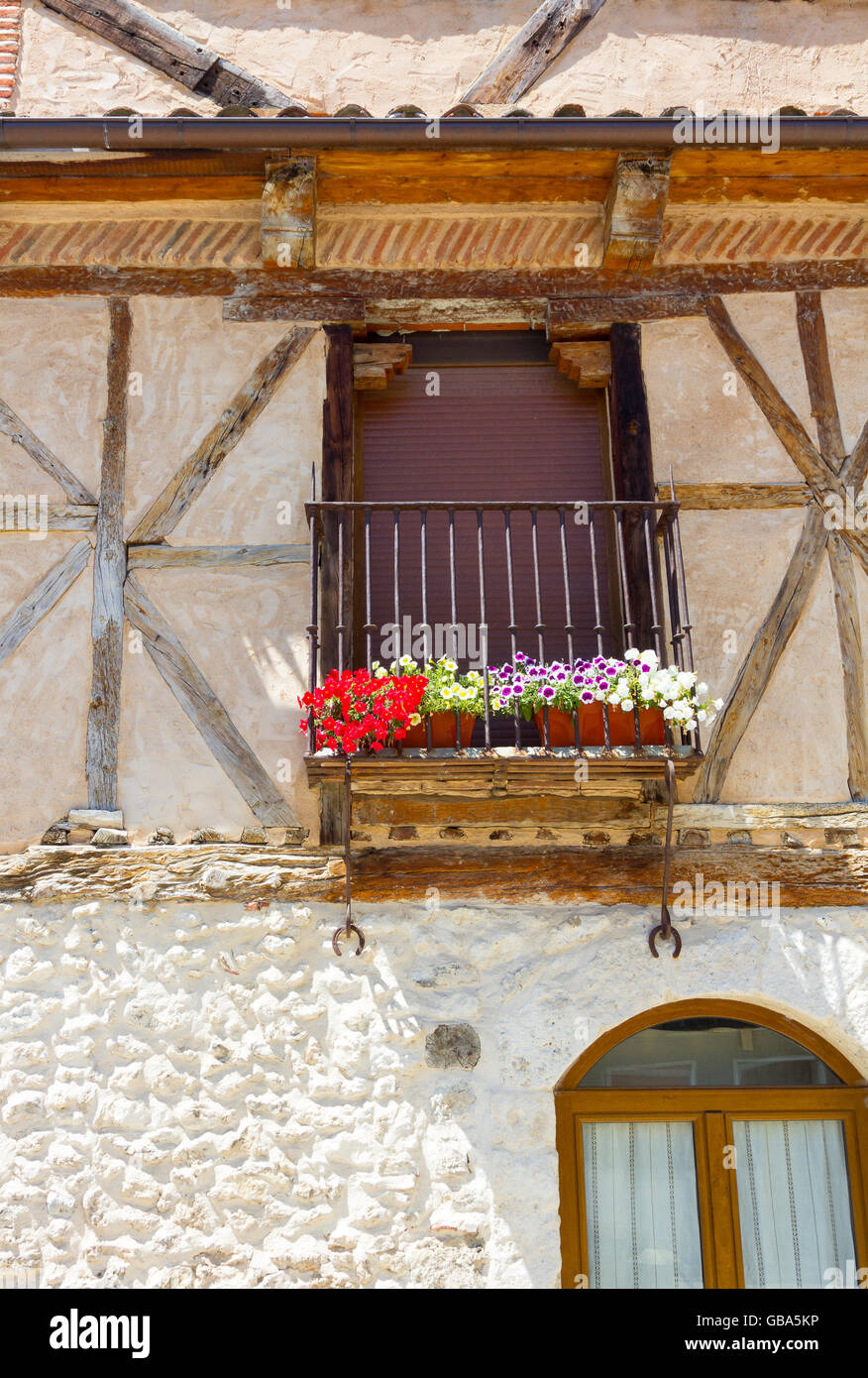 balcony window with black grille and flowers Stock Photo - Alamy