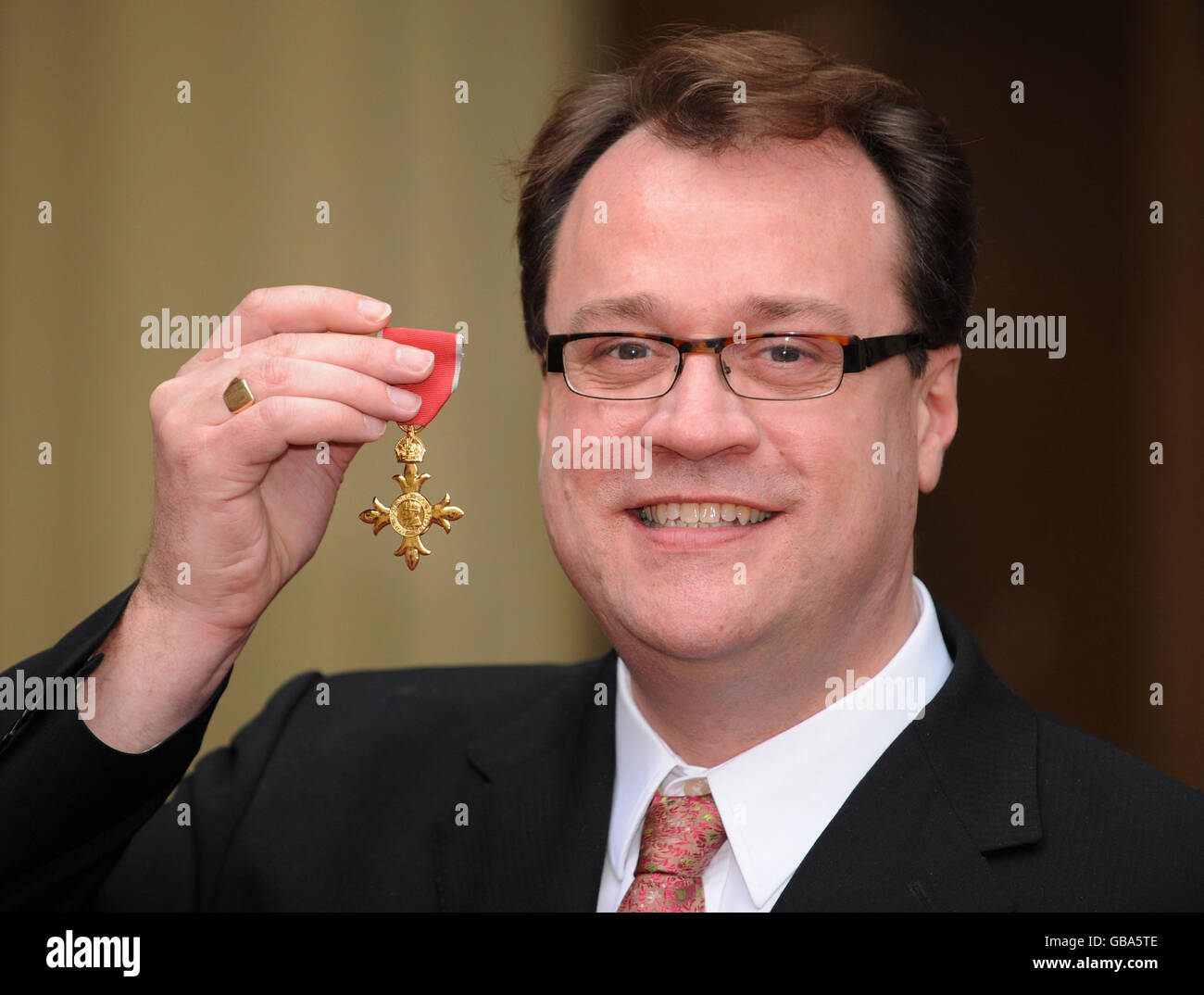 Royal investiture head shot headshot eye contact smiling glasses medal ...