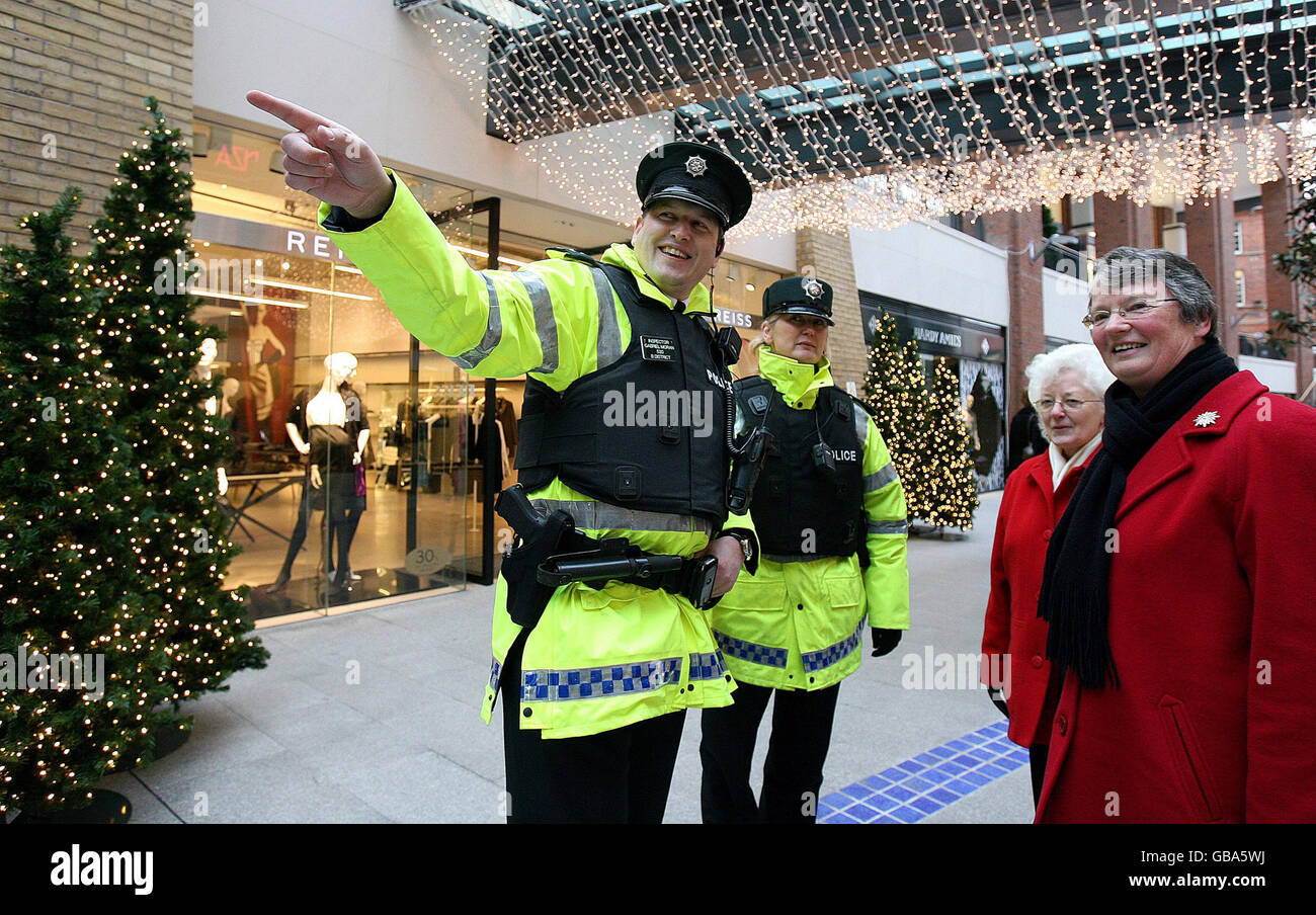 Police officers talk to shoppers in the Victoria centre in Belfast ...