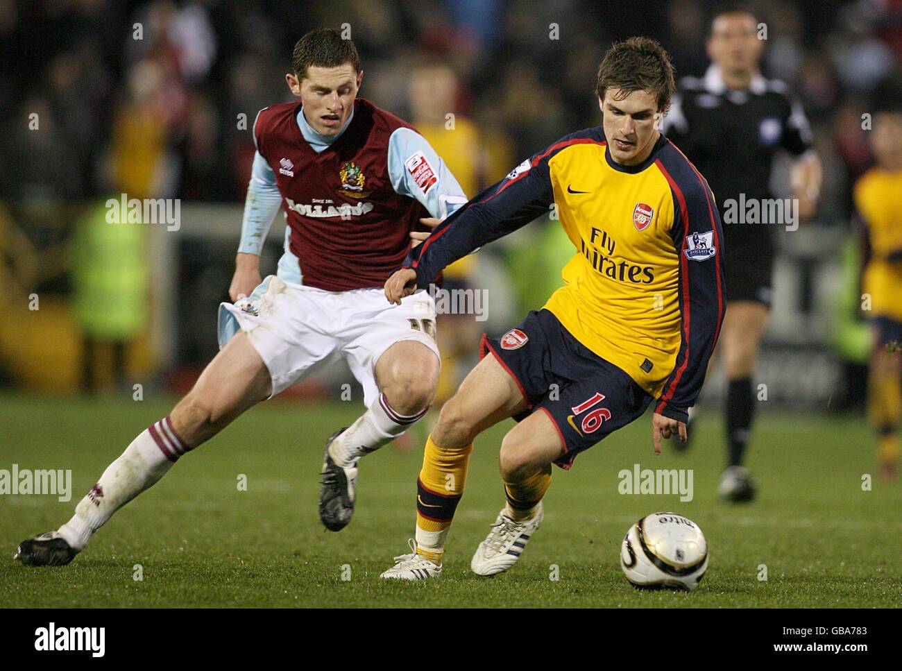 Burnley's Chris McCann and Arsenal's Aaron Ramsey in action Stock Photo ...