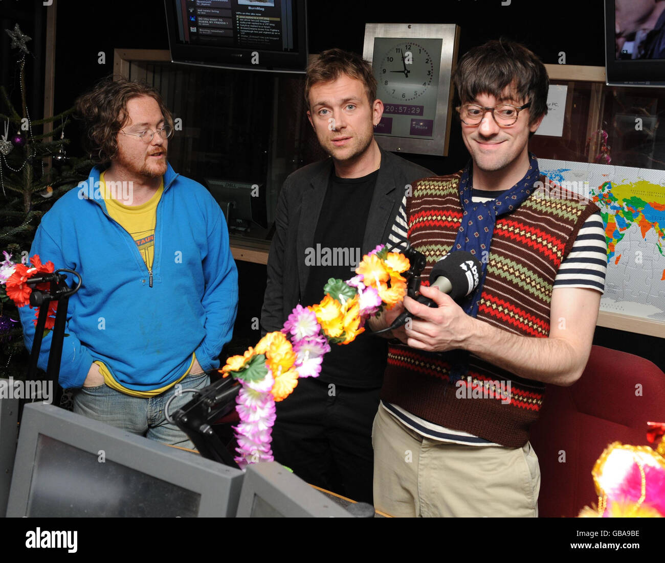 From left to right: DJ Geoff Lloyd talks with Damon Albarn and Graham ...