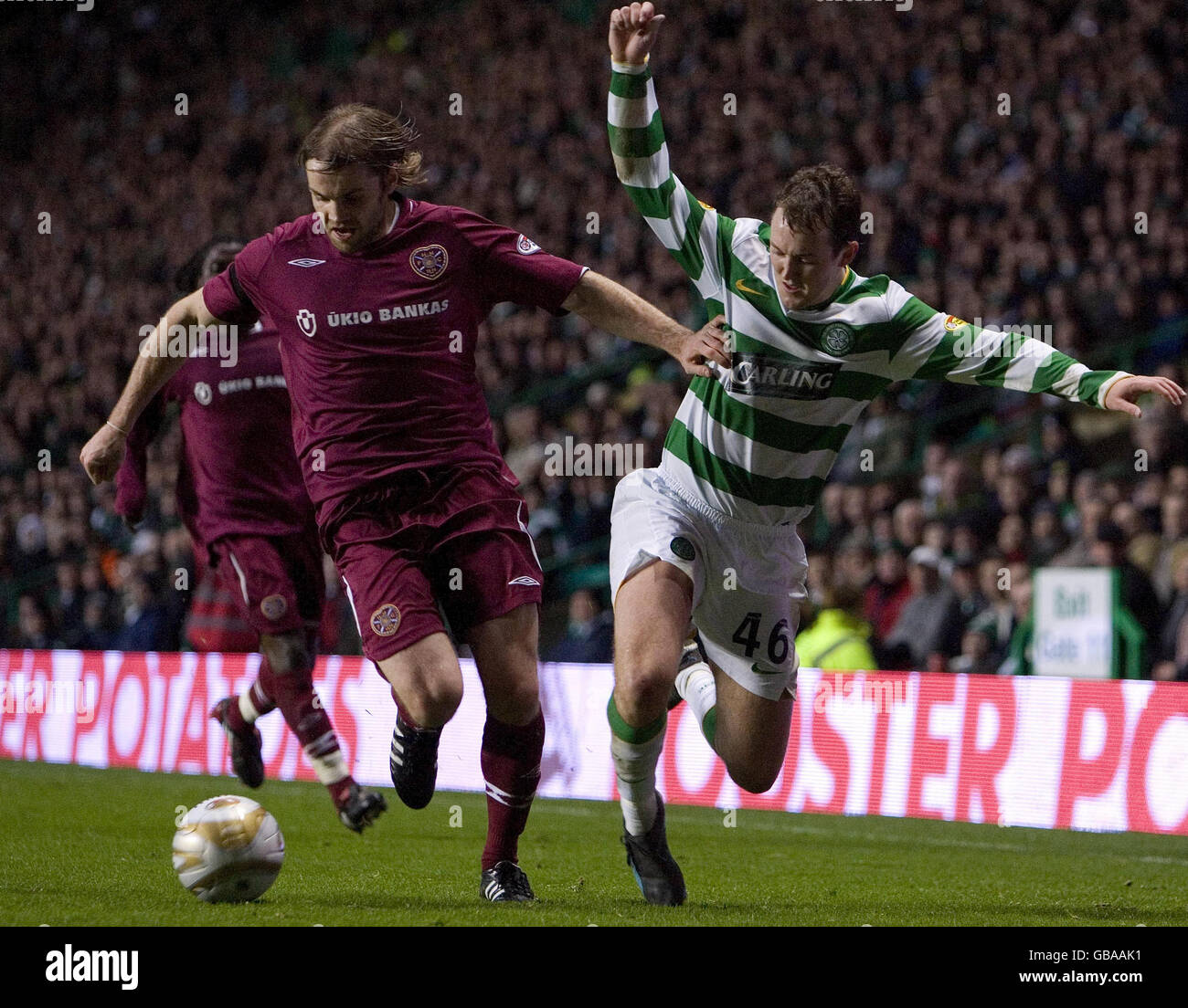 Hearts (left) Robbie Neilson battles with Celtic's Aiden McGeady during ...