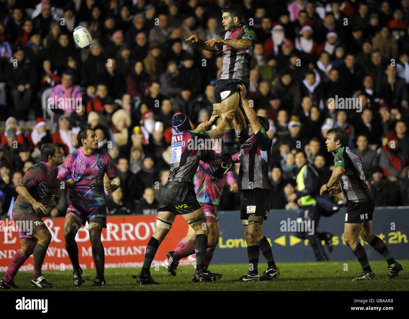 Harlequins' Nick Easter passes from the line out during the Heineken ...