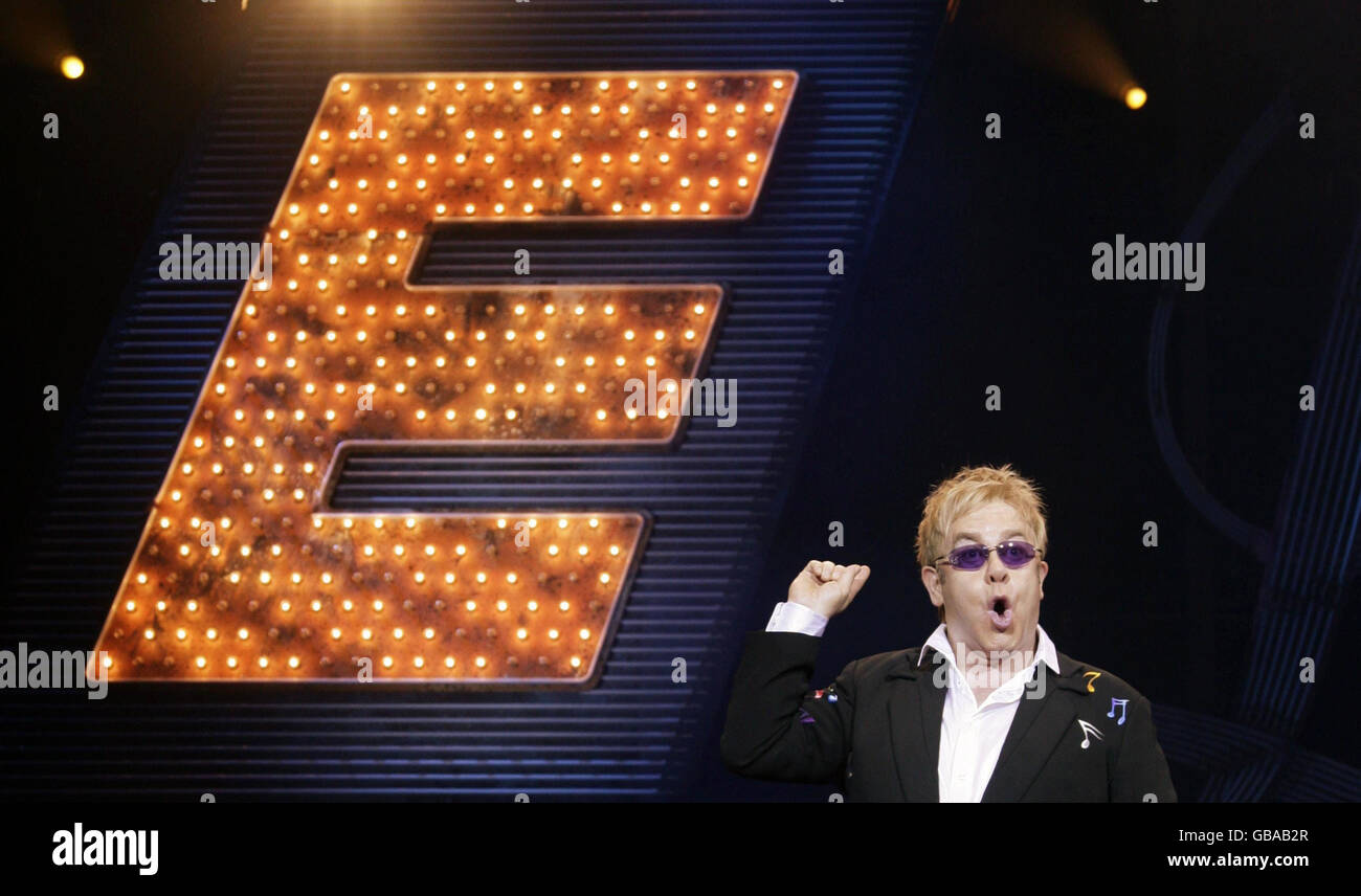 Elton John performing on stage during his 'Red Piano' tour at the O2 ...
