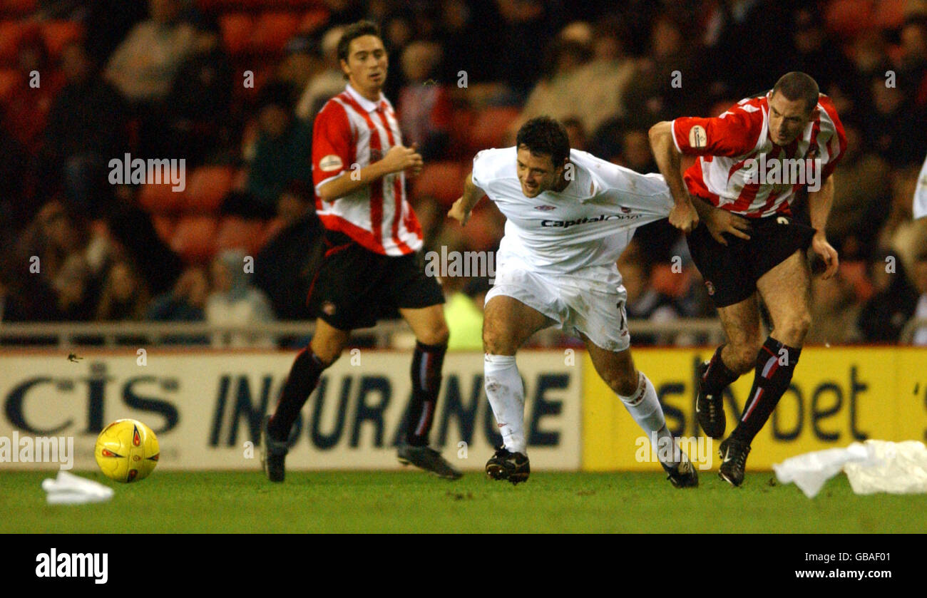 Nottingham Forest's Andy Reid is pulled back by Sunderland's Stephen ...