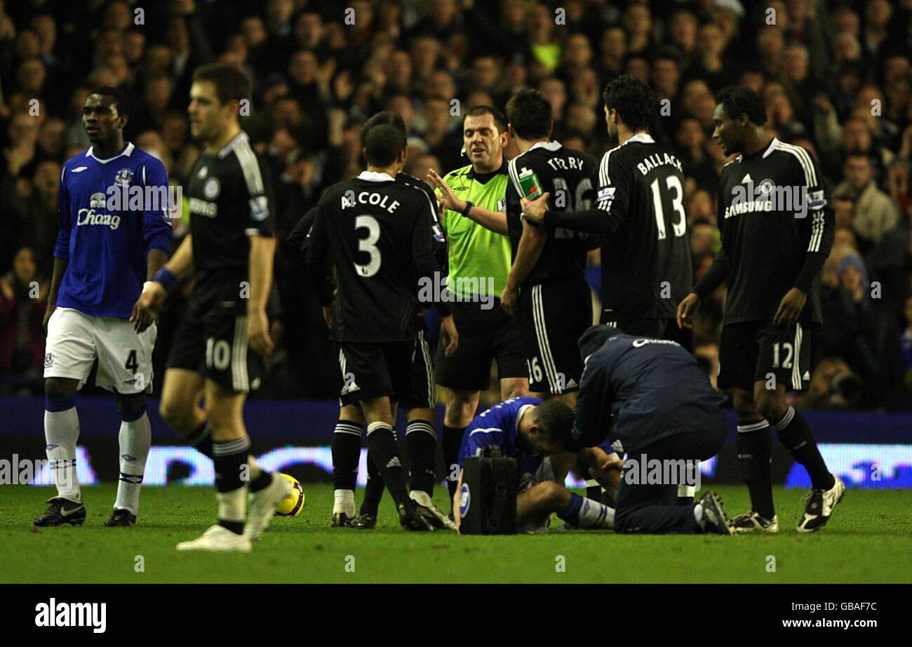 Chelsea's John Terry argues with referee Phil Dowd after being shown a red card for a foul on ...