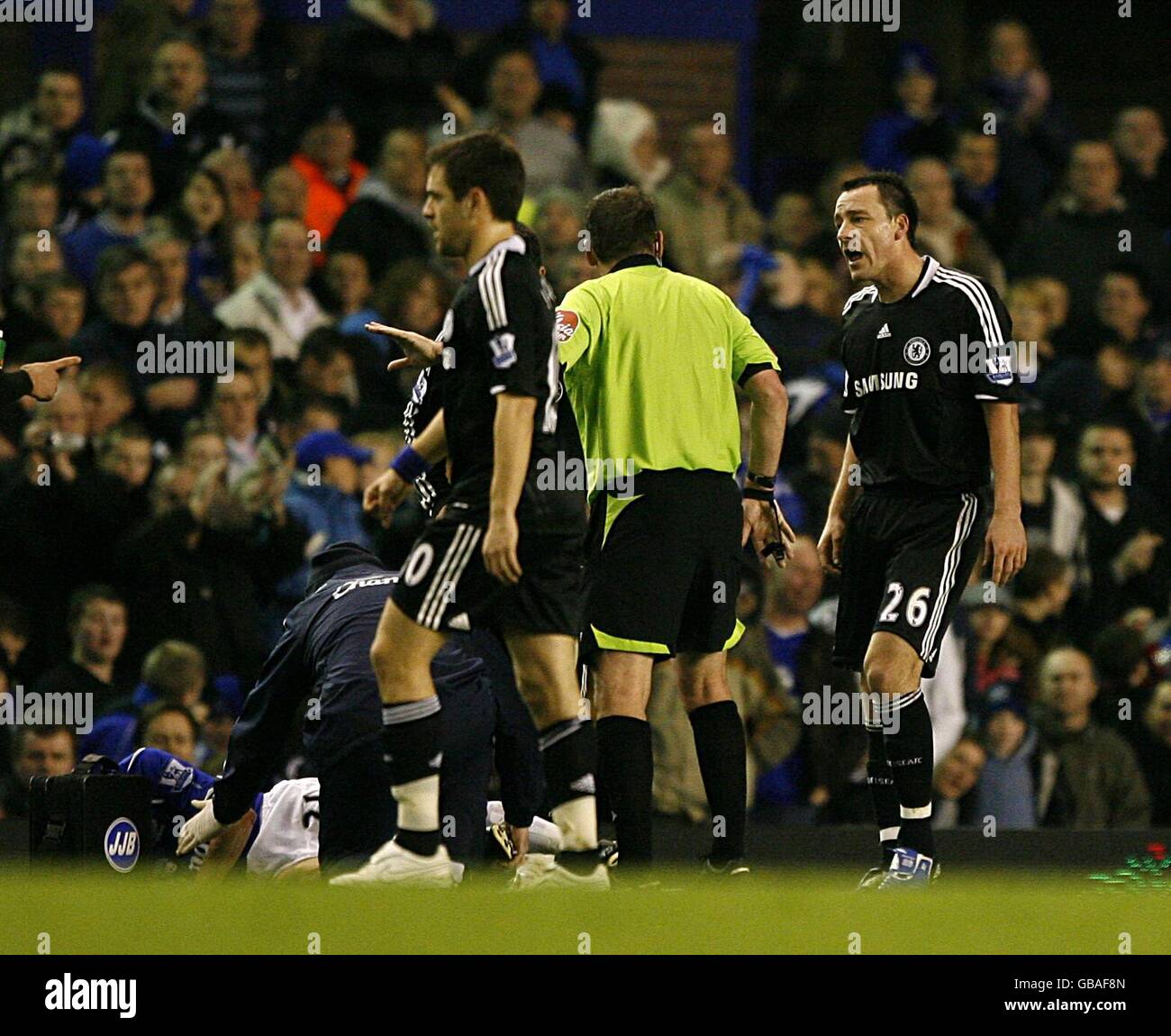 Chelsea's John Terry argues with referee Phil Dowd after being shown a red card for a foul on ...