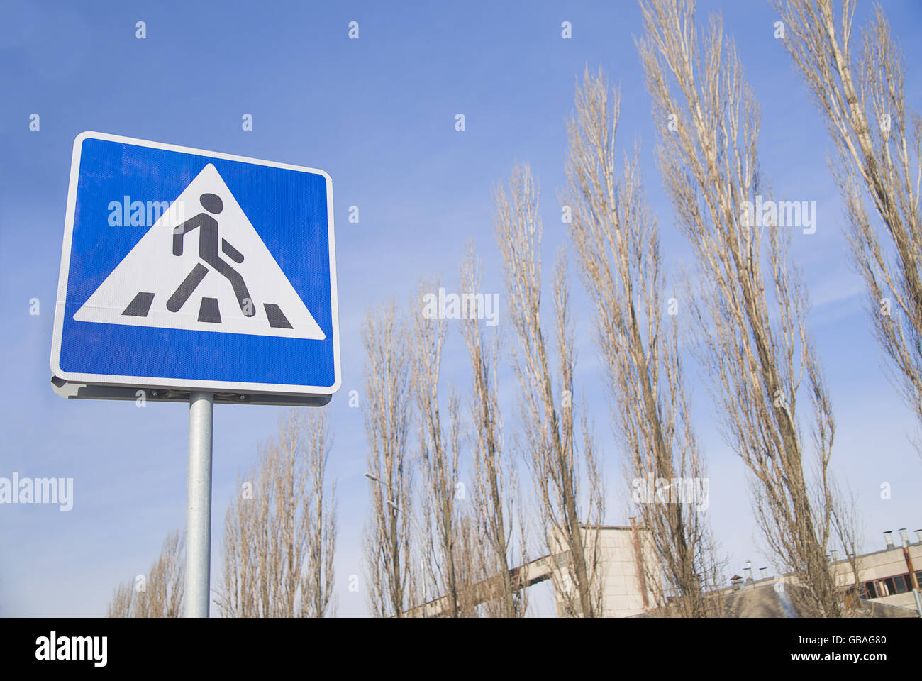 Big sign pedestrian crossing against the blue sky Stock Photo - Alamy