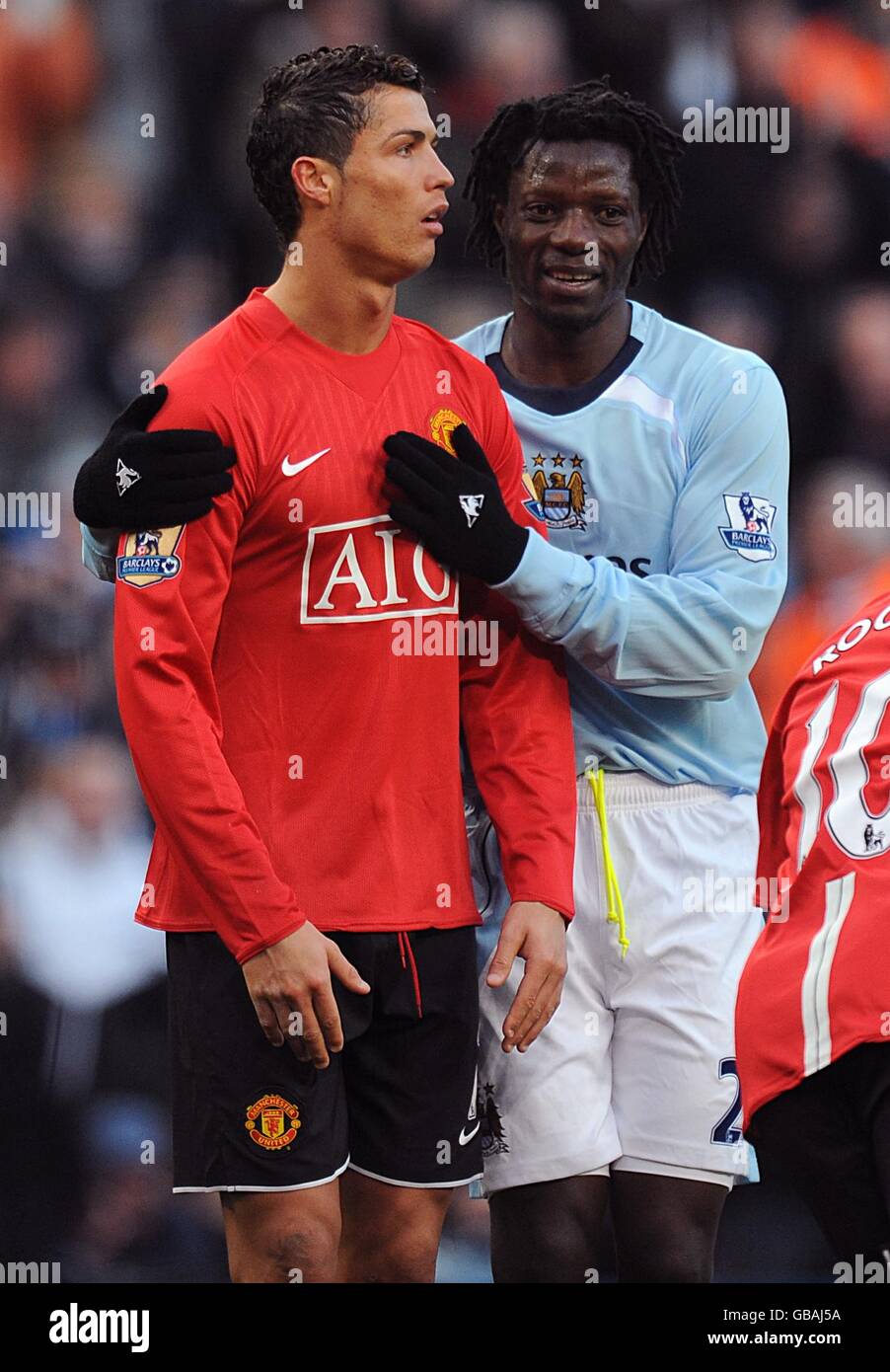 Manchester City's Benjani Mwaruwari (right) shows Manchester United's ...