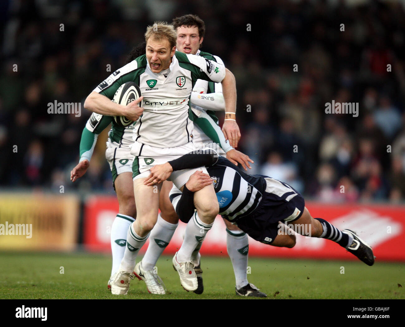 Peter Hewat of London Irish is tackled by Bristol's Neil Brew during ...