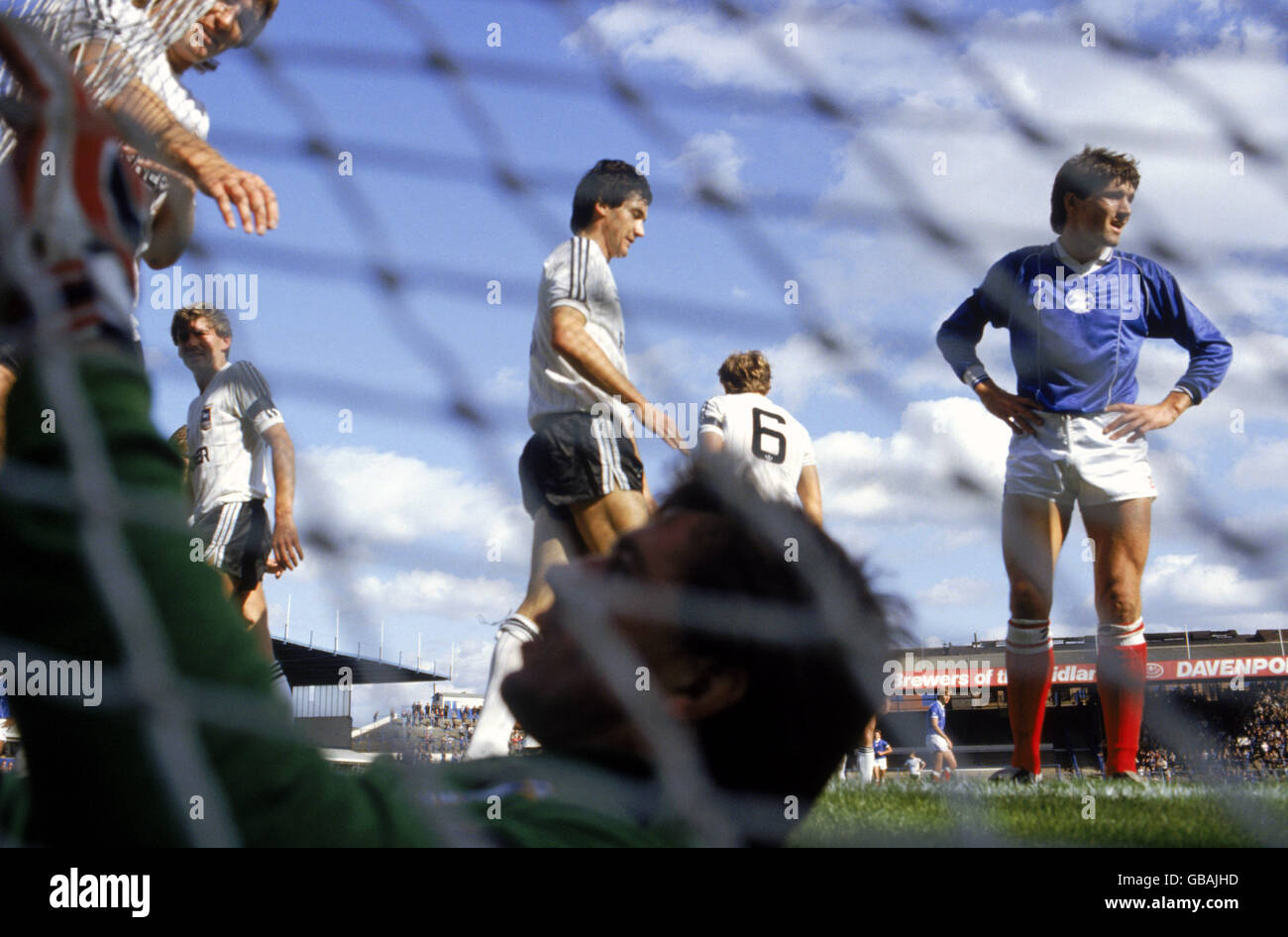 Ipswich Town's Russell Osman (top l) reaches out to help up teammate ...