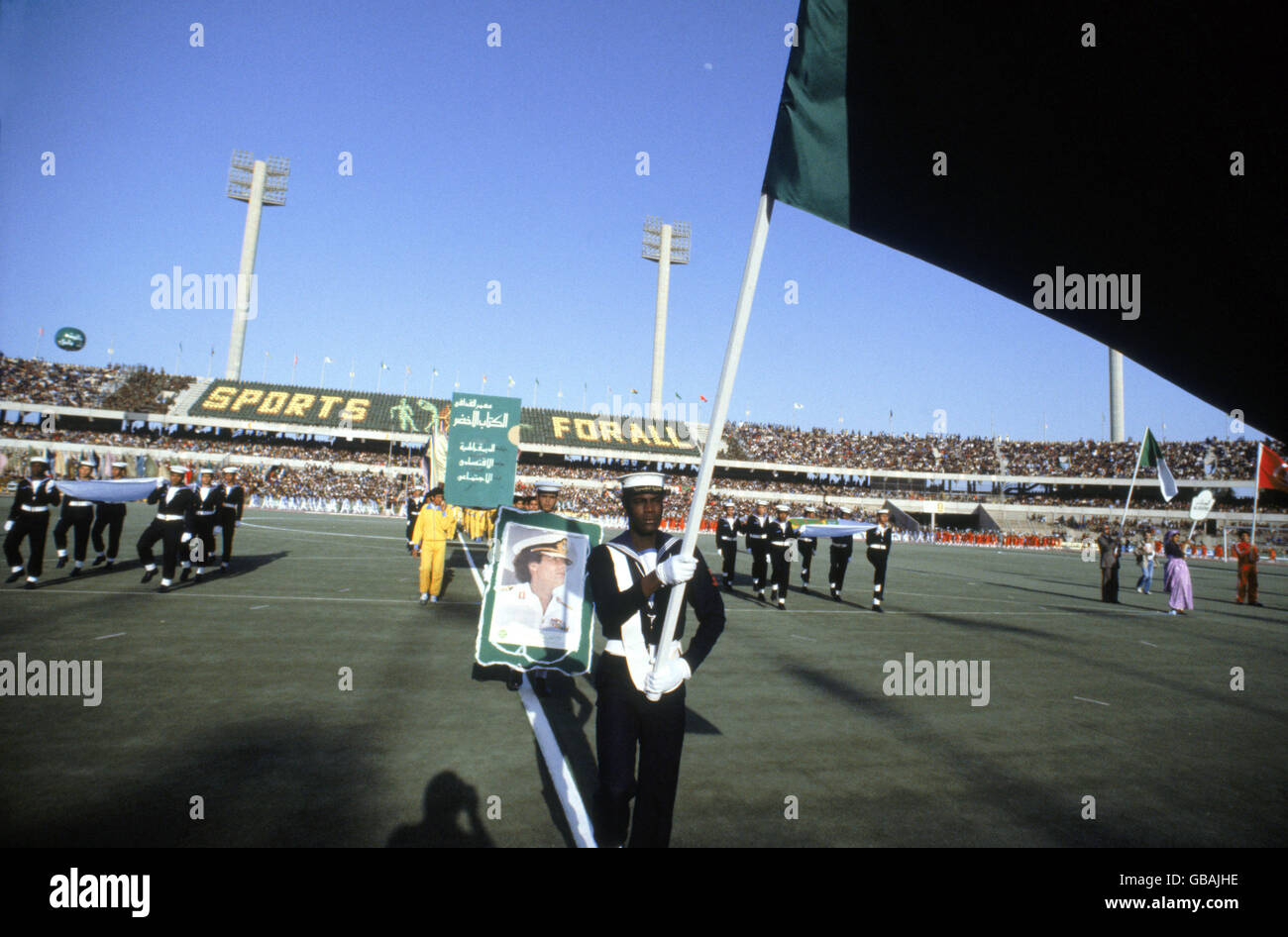 The Libyan Navy parade across the pitch bearing an picture of Colonel ...