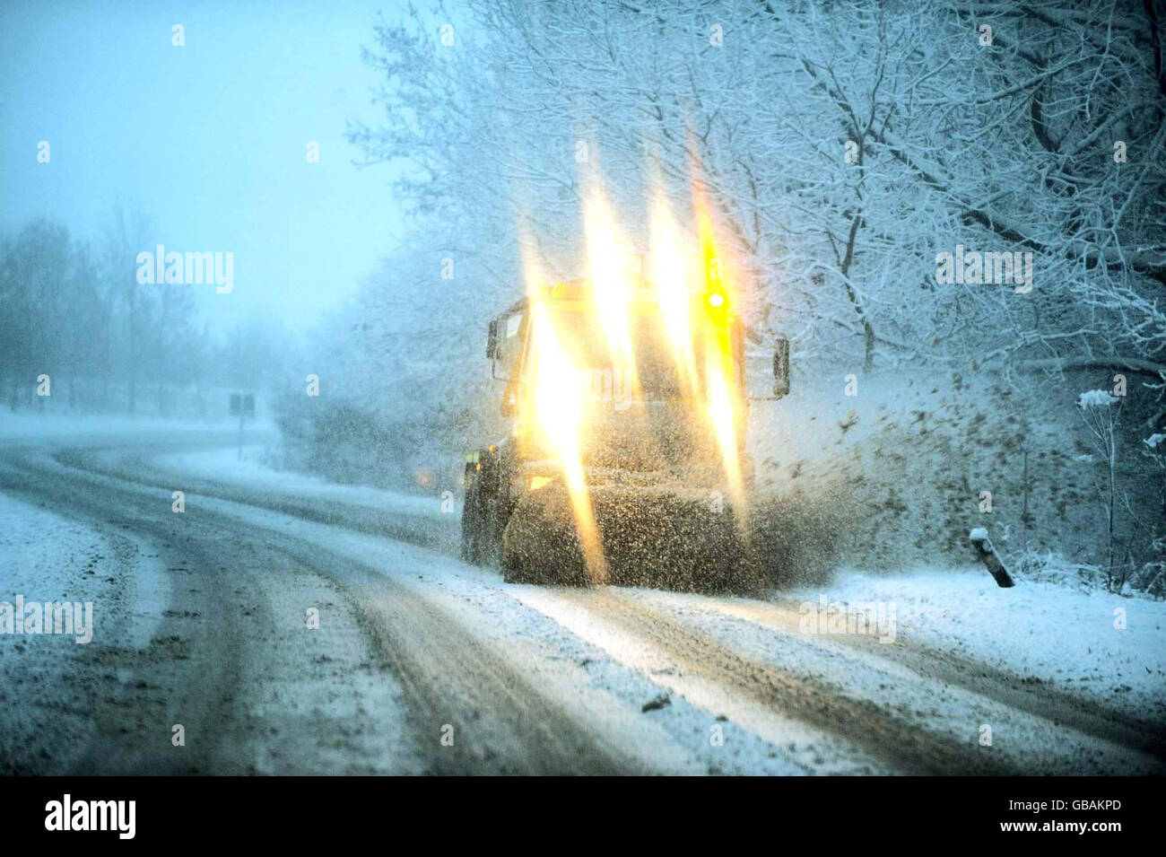 A snow plow clears snow from a road in County Durham Stock Photo - Alamy