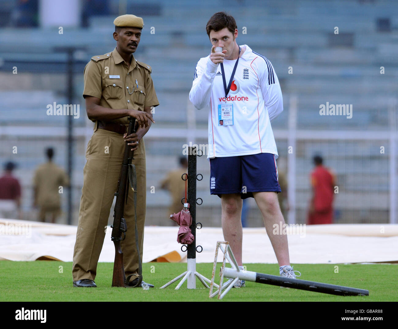 Security advisor Sam Dickason (right) speaks with an armed guard during ...