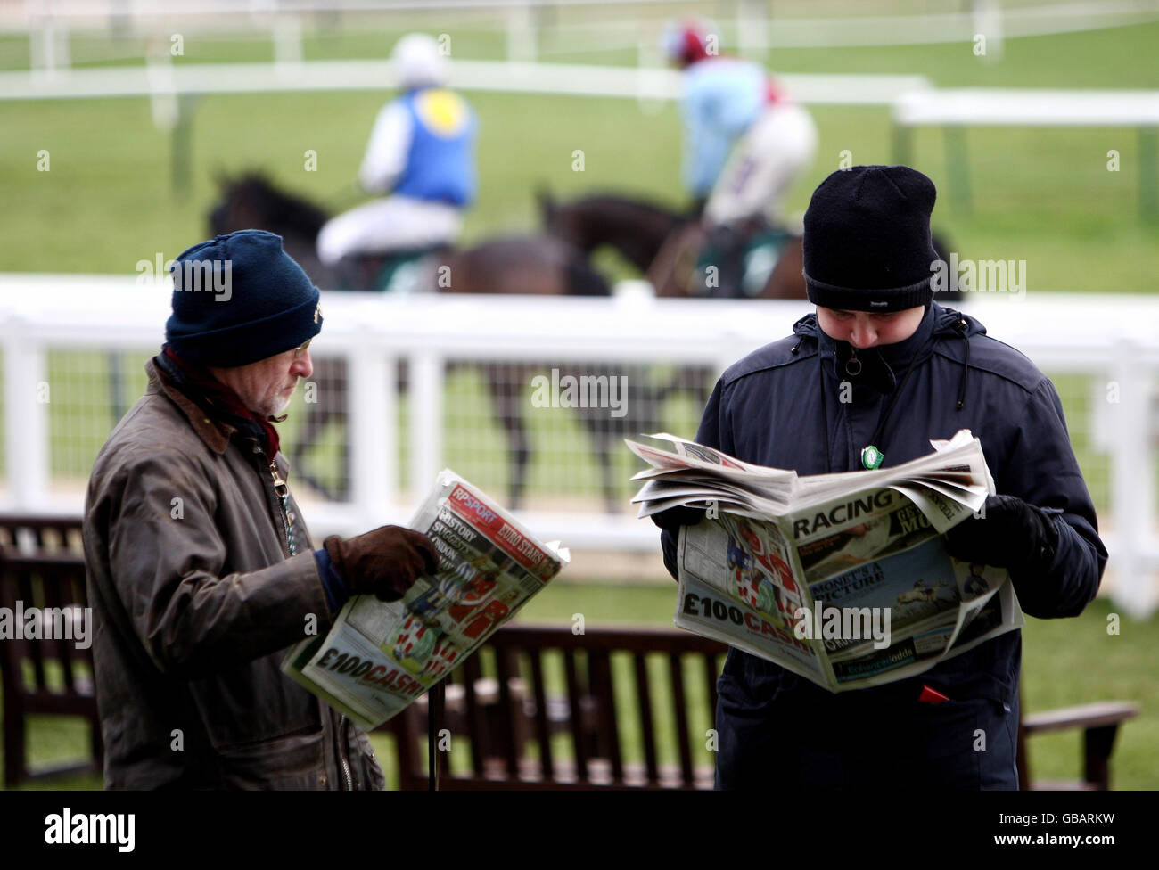 Punters check the form in the Racing Post during the Boylesports ...