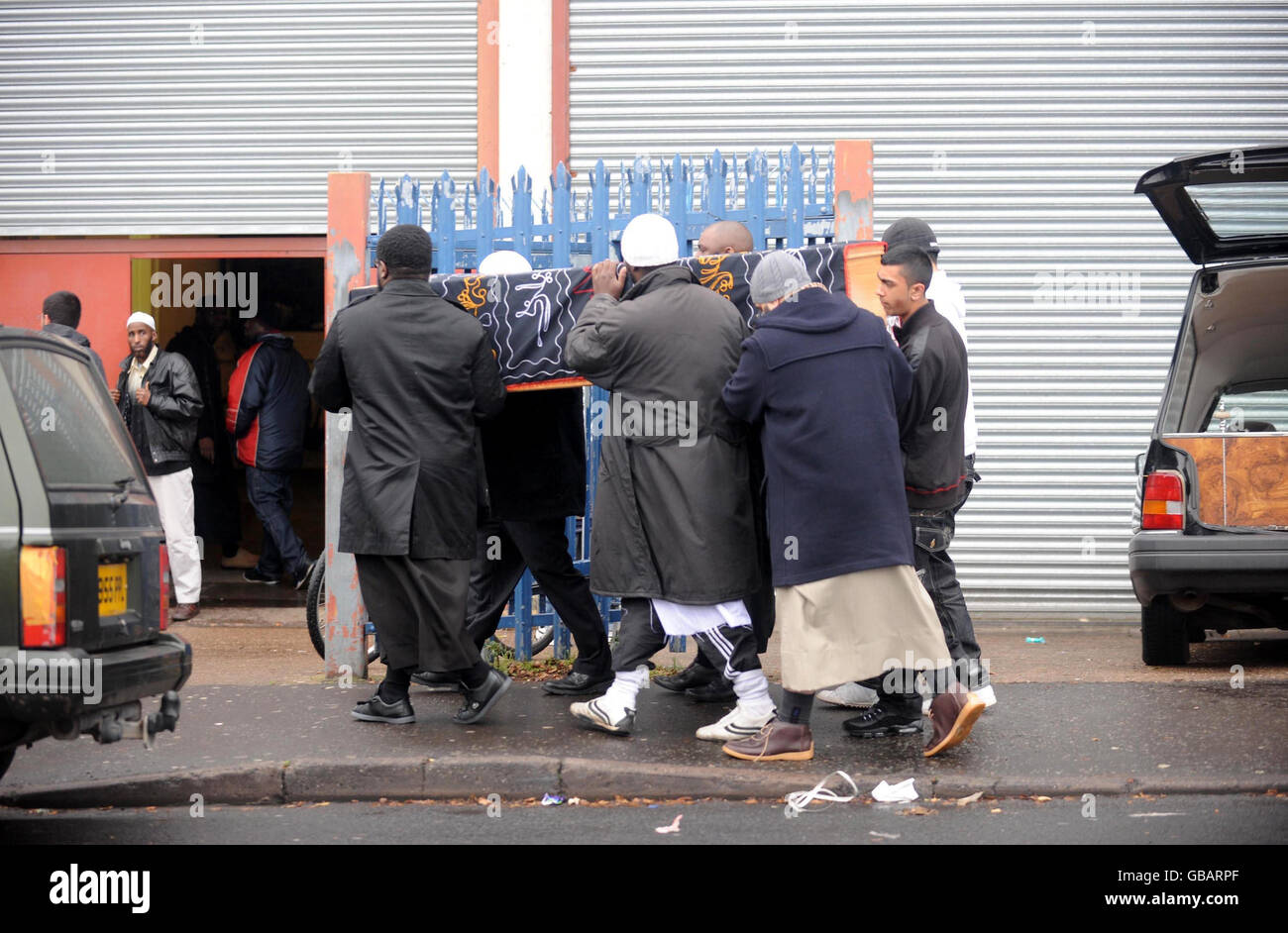 Mourners carry the coffin into the Salafi Masjid mosque in Small Heath ...