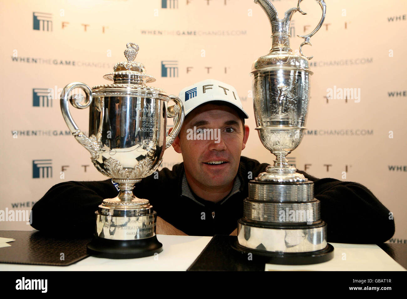 Golf star Padraig Harrington with his two Open trophies during a press ...