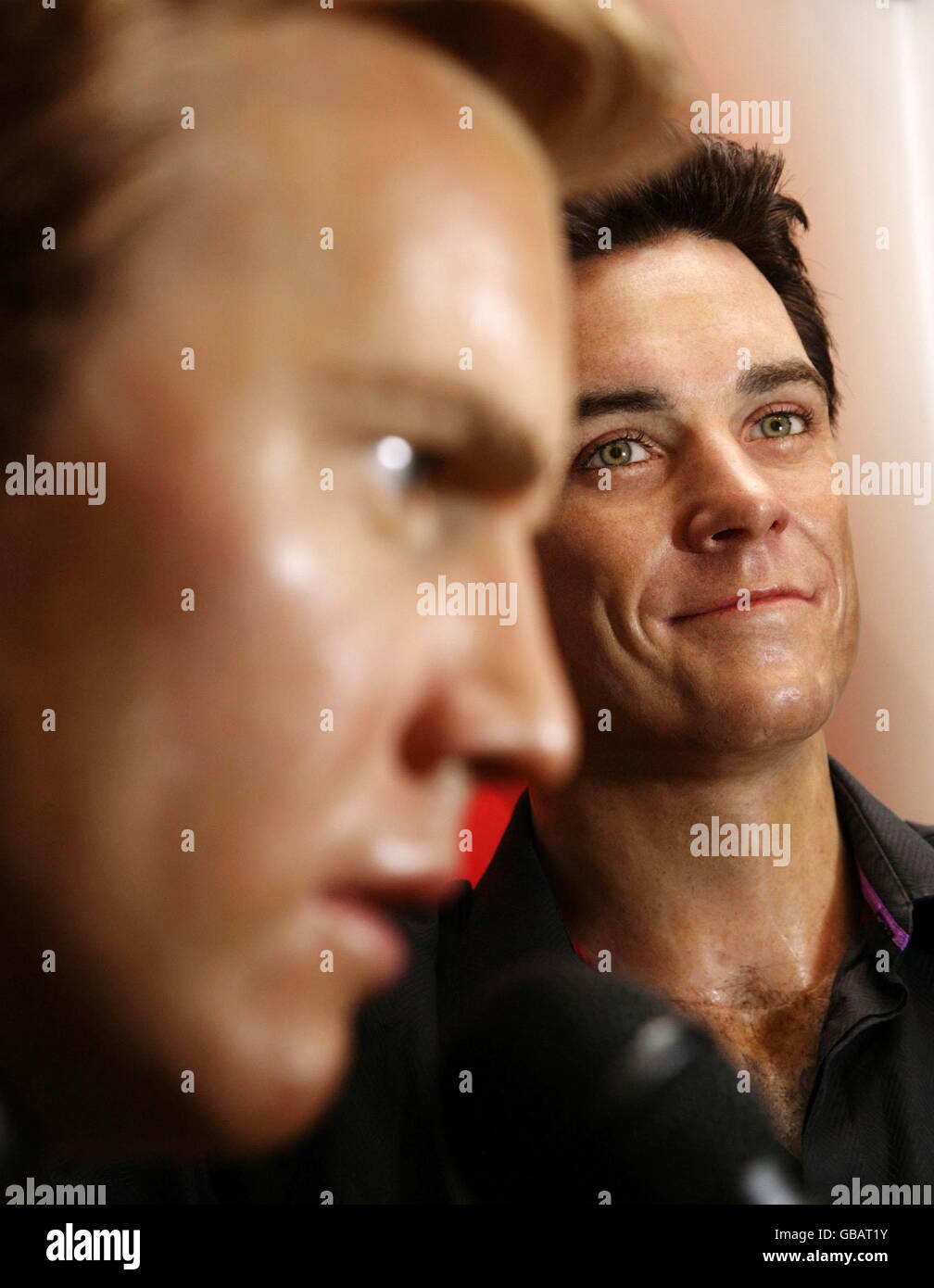 Wax models of Take That singer Gary Barlow (L) and former member Robbie ...