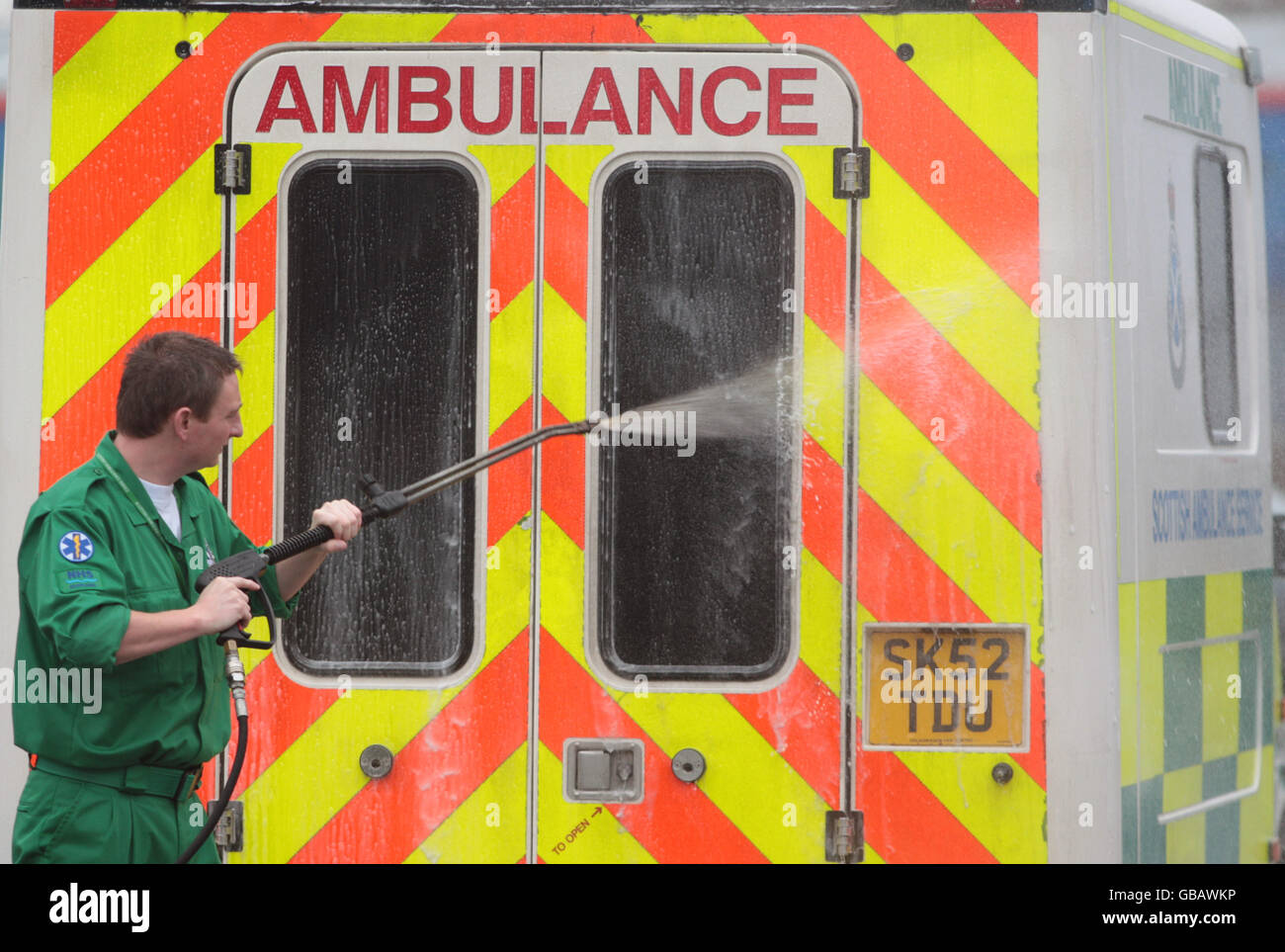 A driver cleans his ambulance before starting his day as Justice ...