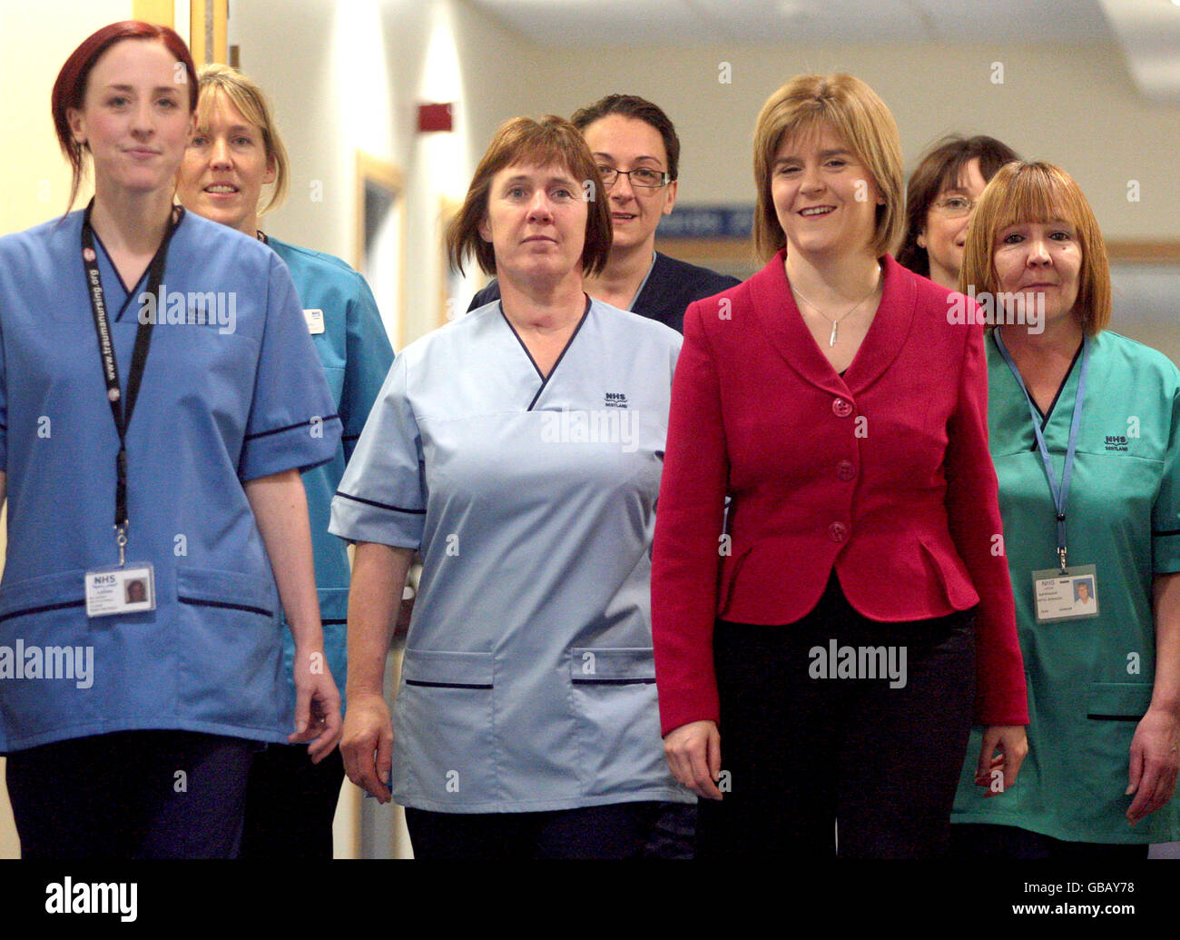 Health secretary Nicola Sturgeon (second right) talks to hospital staff ...