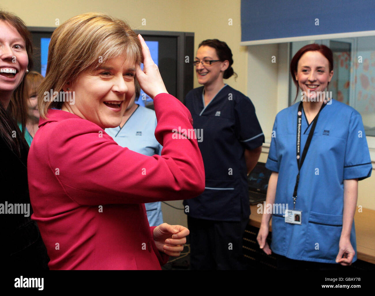 Health secretary Nicola Sturgeon (second left) talks to hospital staff ...