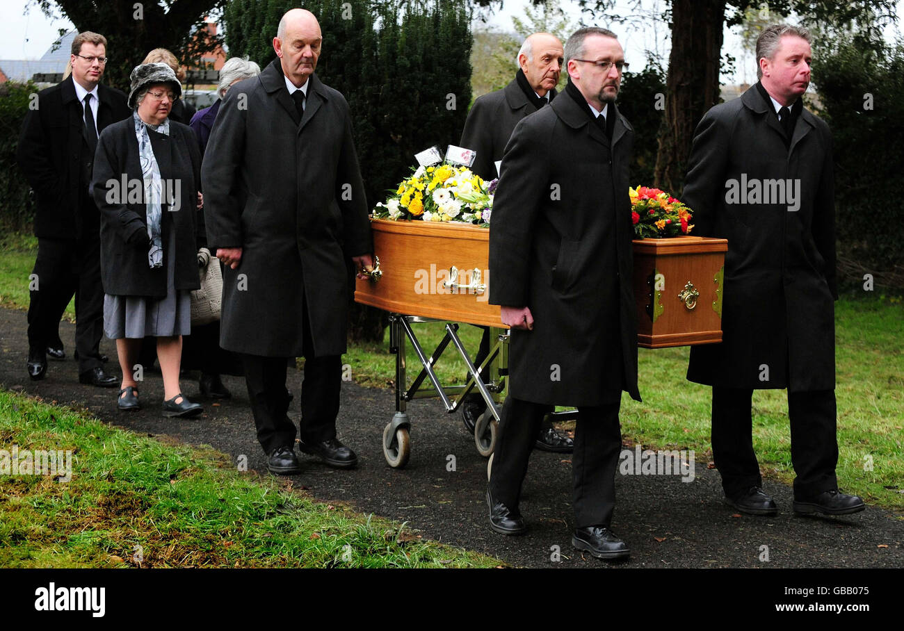 Family members follow the coffin as they arrive for the funeral of ...