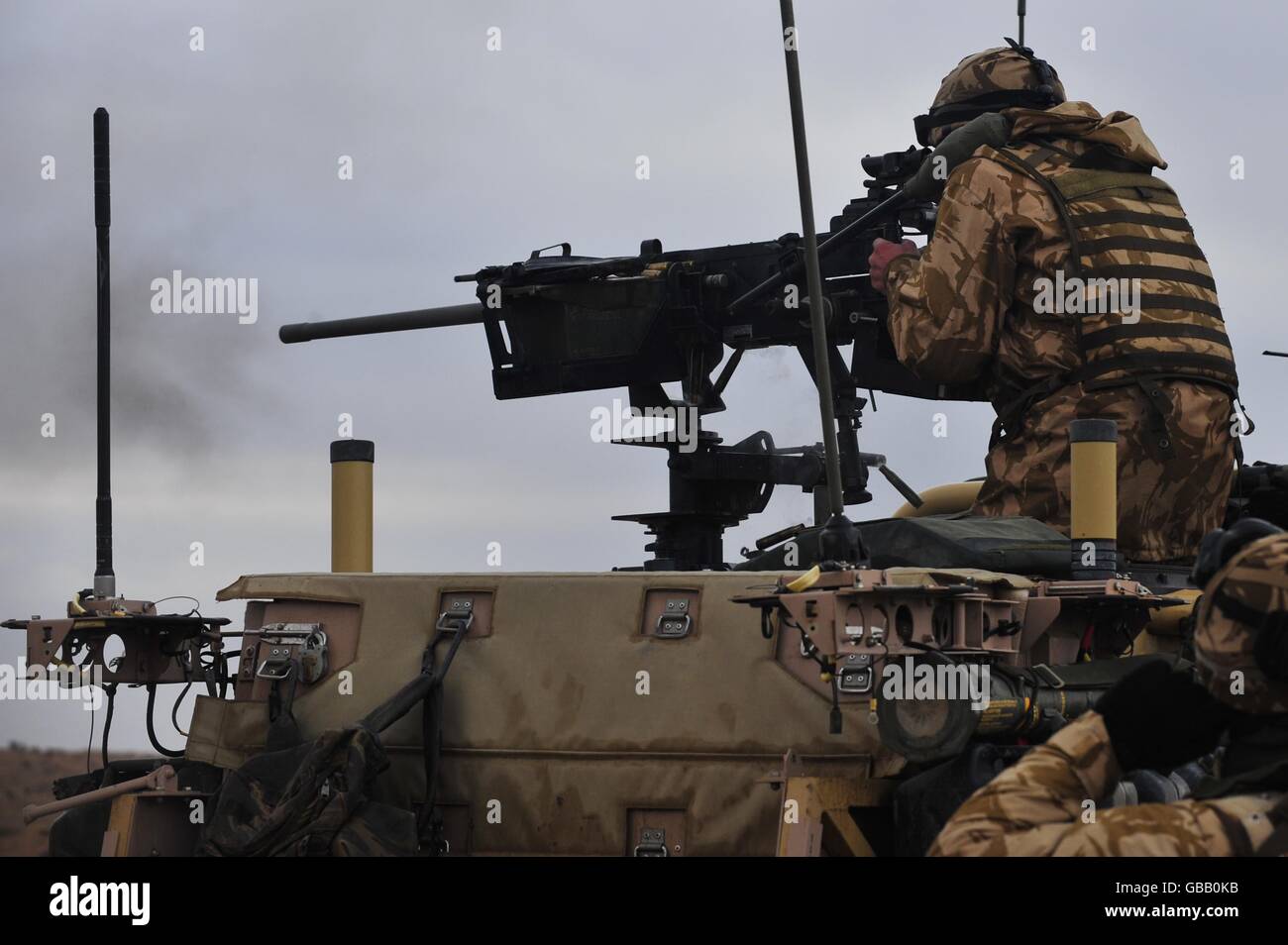A soldier test fires a 50 cal machine gun mounted on a Jackal in the ...