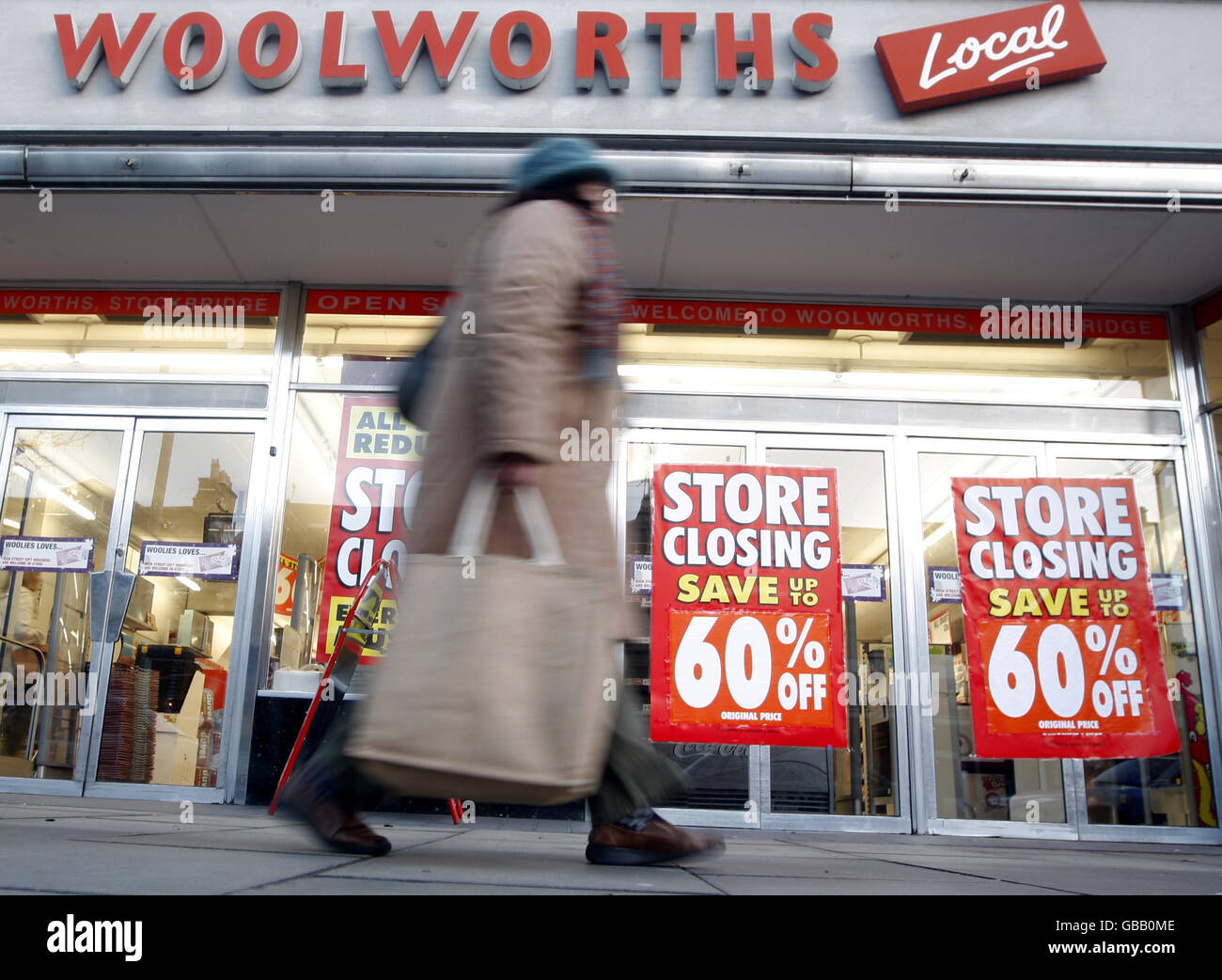 A shopper walks past a branch of Woolworths on Raeburn Place in ...