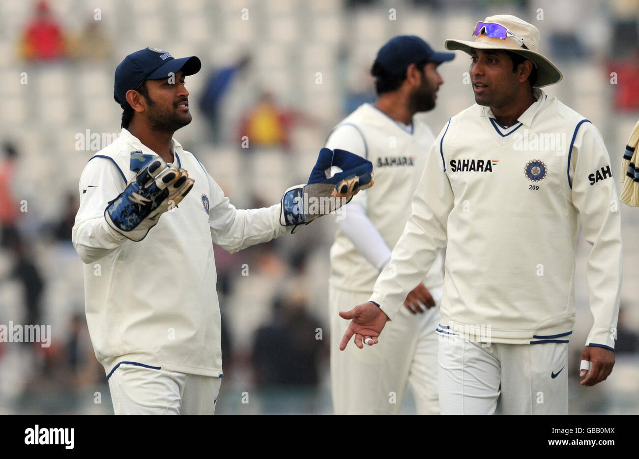 India's MS Dhoni gestures as the players leave the field for bad light ...