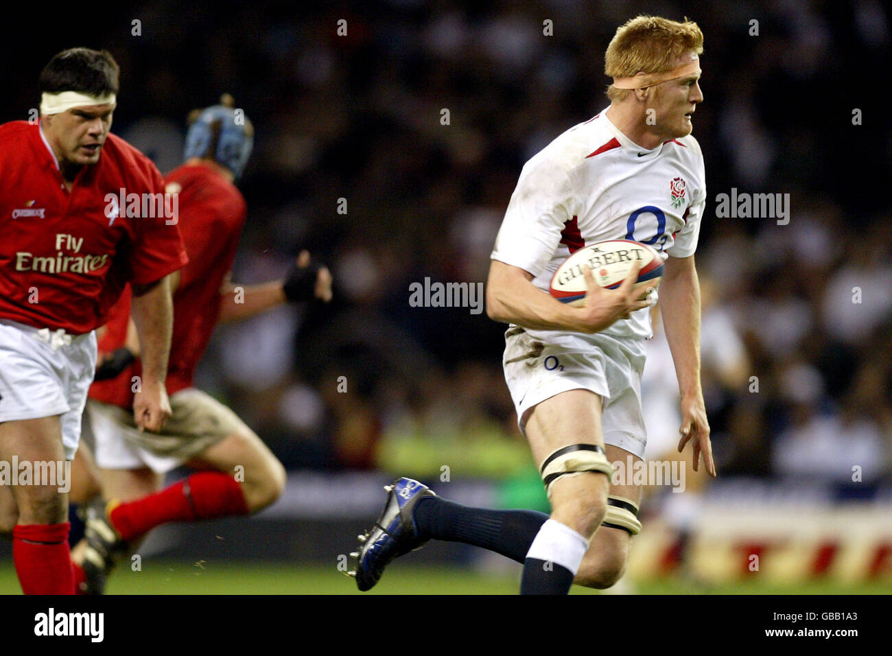 England's Hugh Vyvyan (r) makes a clear break through the New Zealand ...