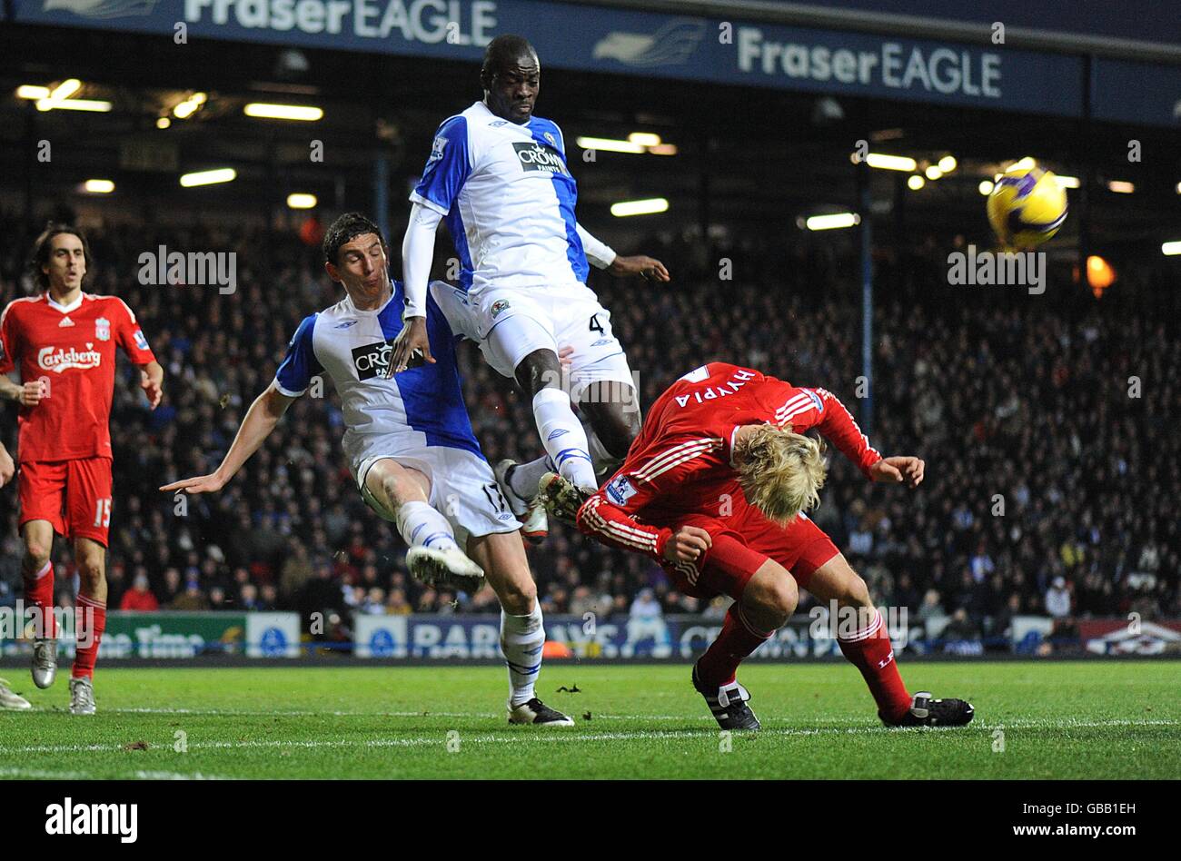 Blackburn Rovers' Keith Andrews (l) and Christopher Samba (c) challenge ...