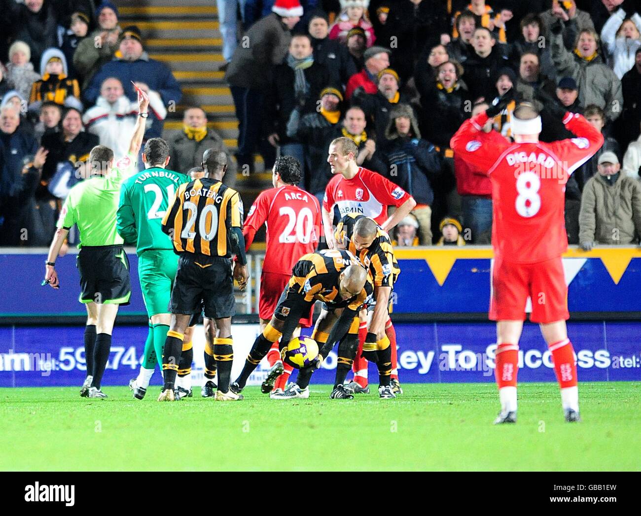 Match referee Steve Tannershows Middlesbrough's David Wheater a red ...