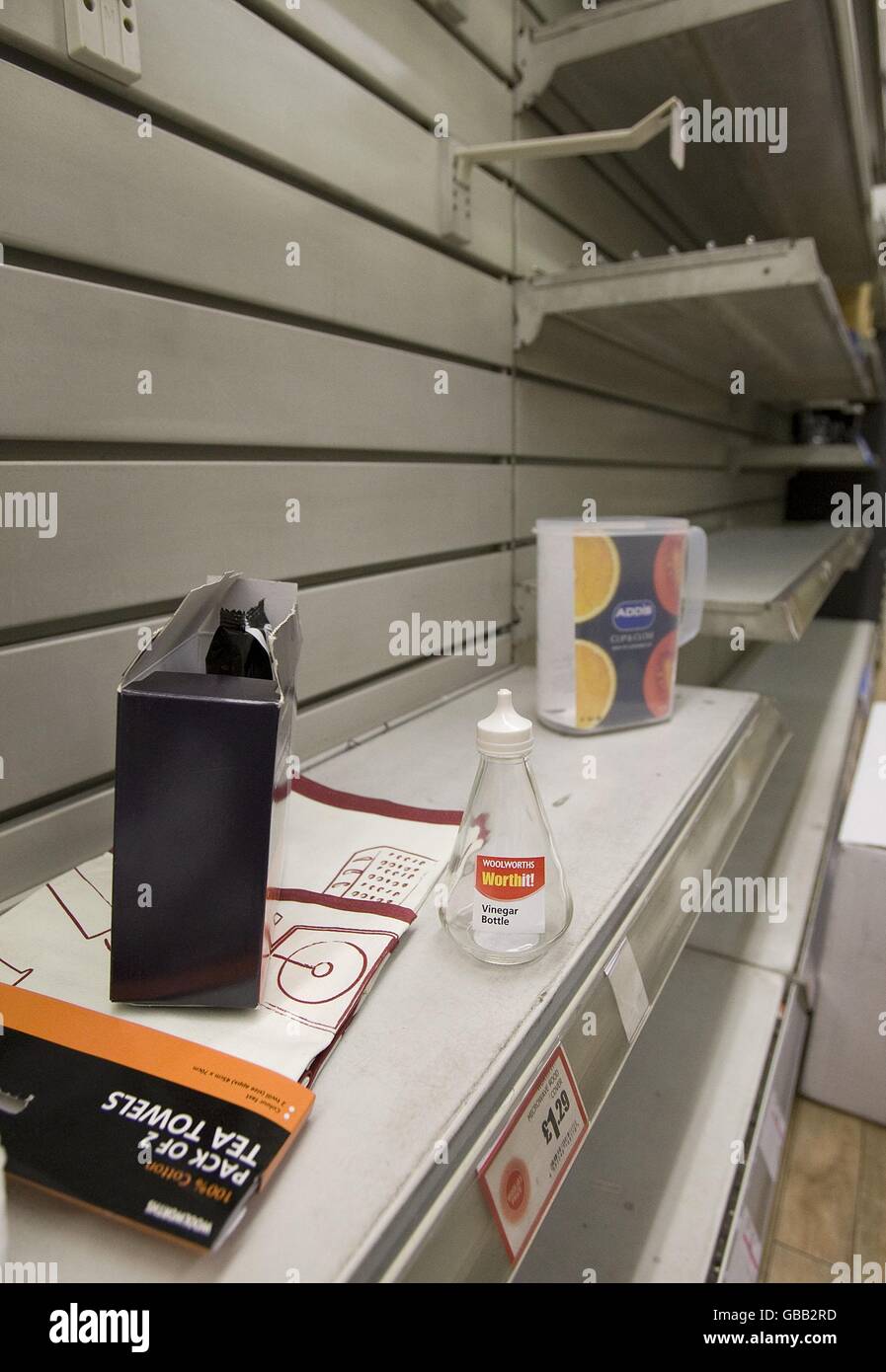 A small number of items remain on a shelf at a Woolworths store in ...