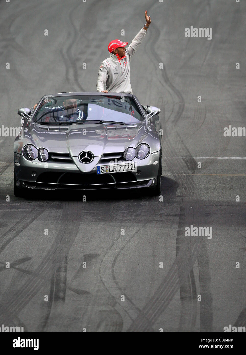 Lewis Hamilton drives a lap of the track after his Car v Bike race with ...