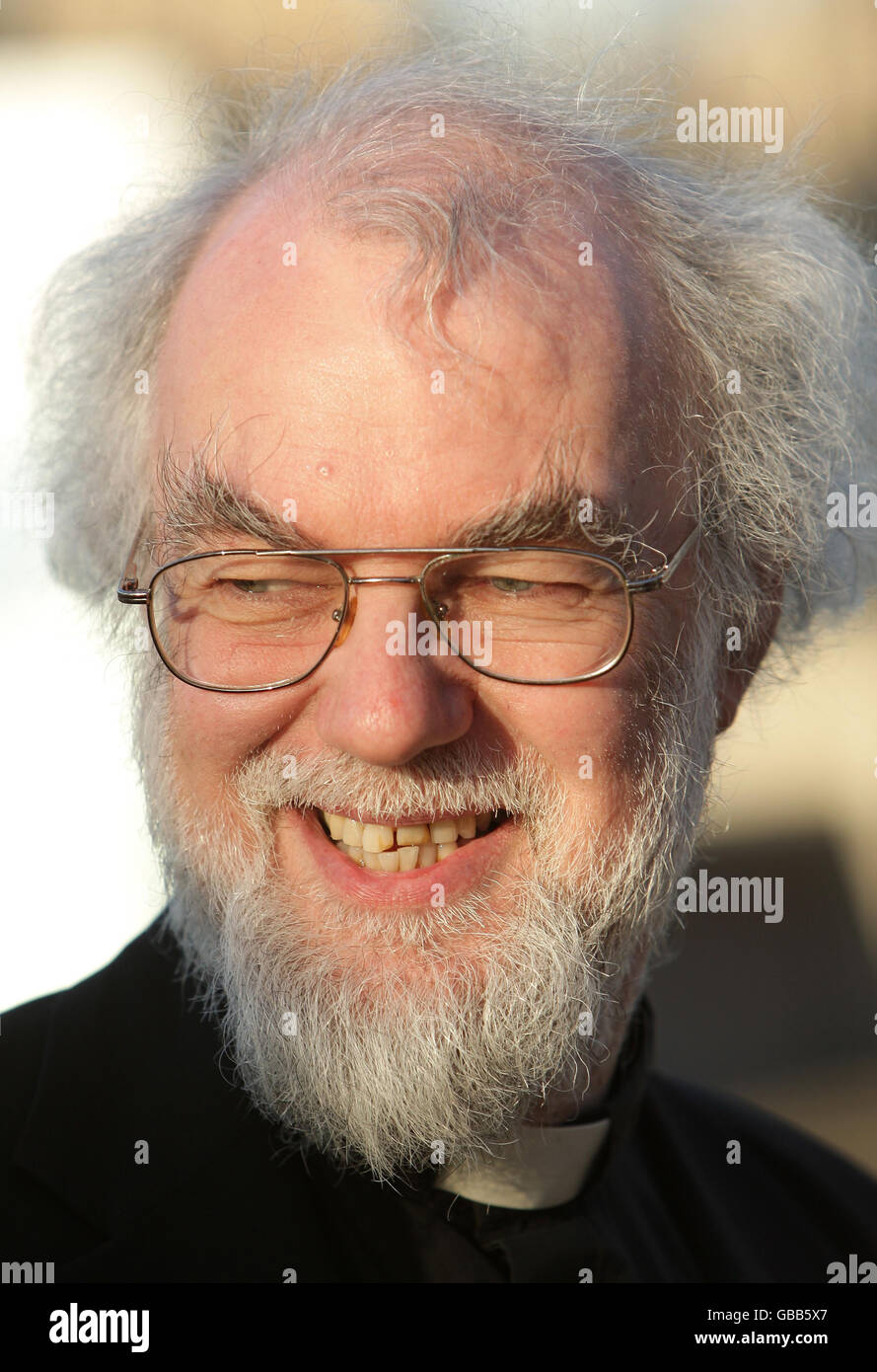 The Archbishop of Canterbury Dr Rowan Williams stands with a Christmas ...