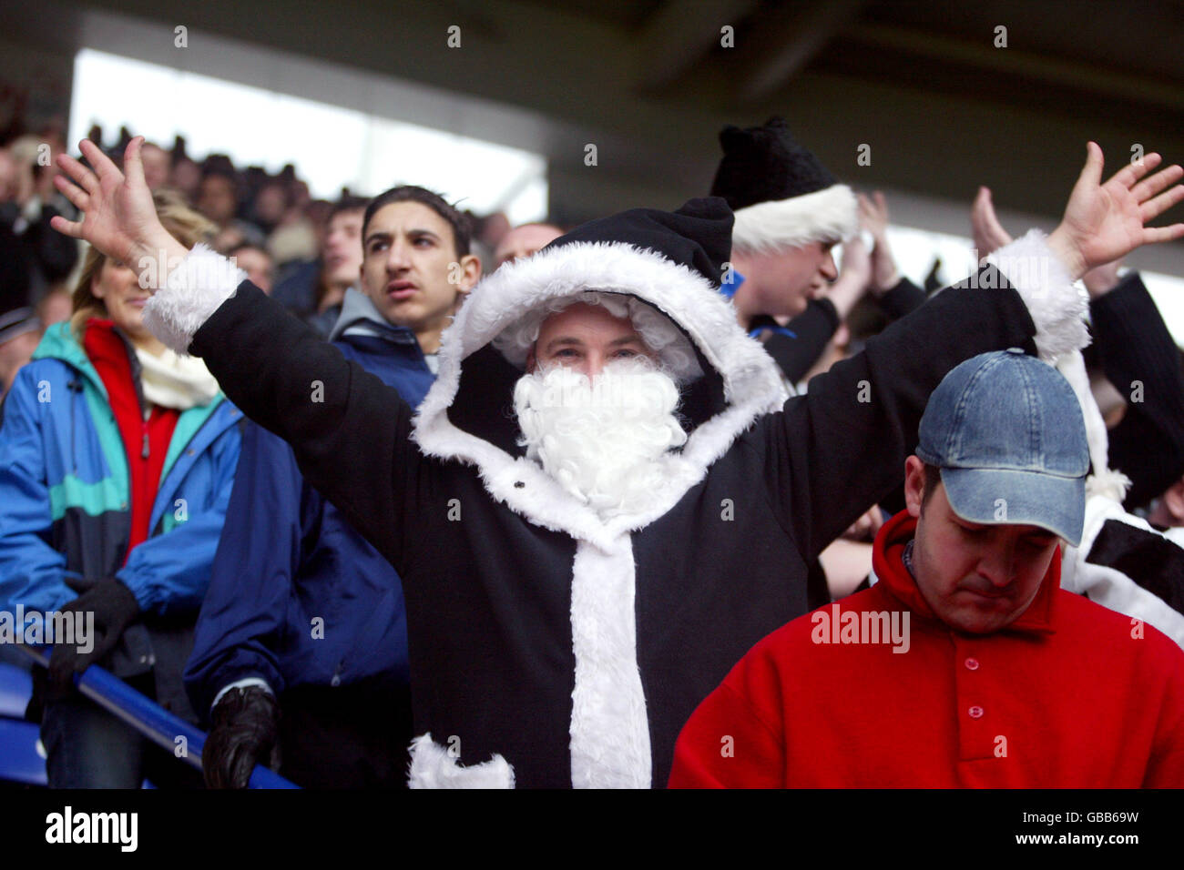 A Newcastle United fan gets into the spirit of christmas by wearing a ...