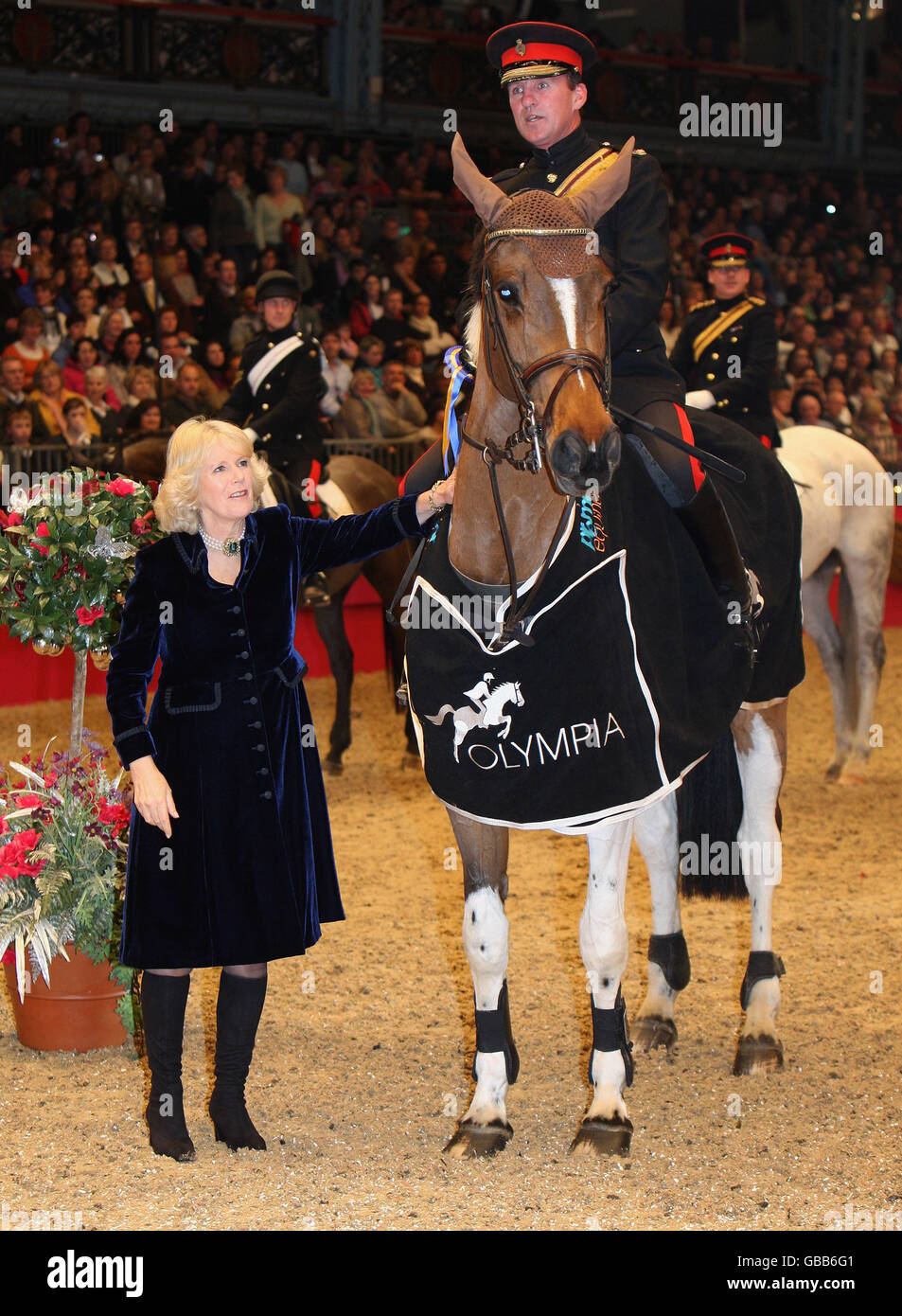 The Duchess of Cornwall presents the winning trophy to Major Richard ...