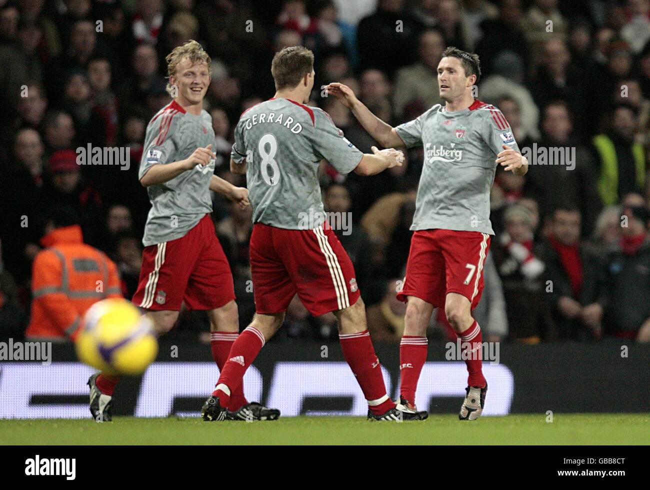 Liverpool's Robbie Keane (r) celebrates scoring his sides first goal ...