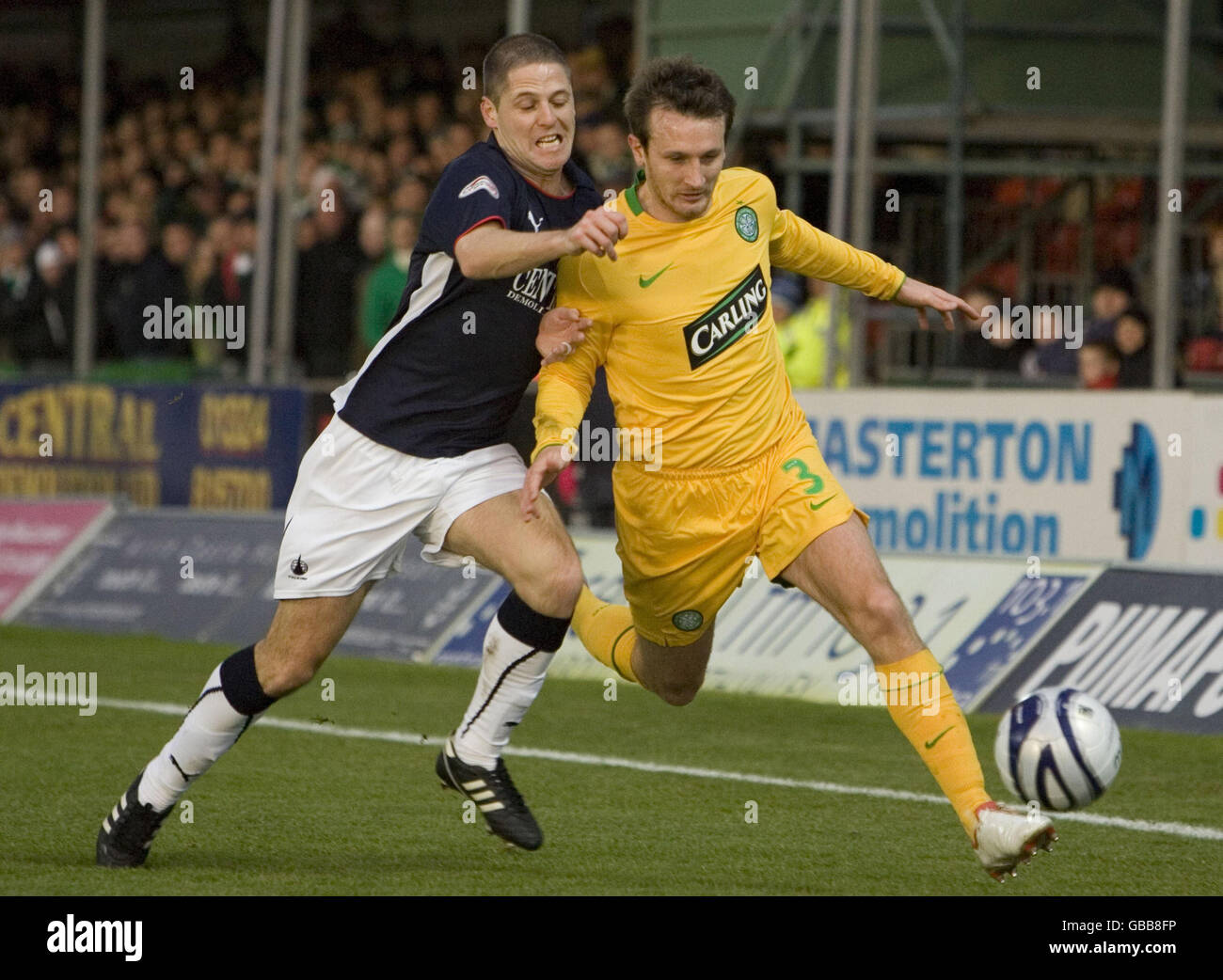Celtic Lee Naylor (right) holds off Falkirk's Graham Barrett during the ...