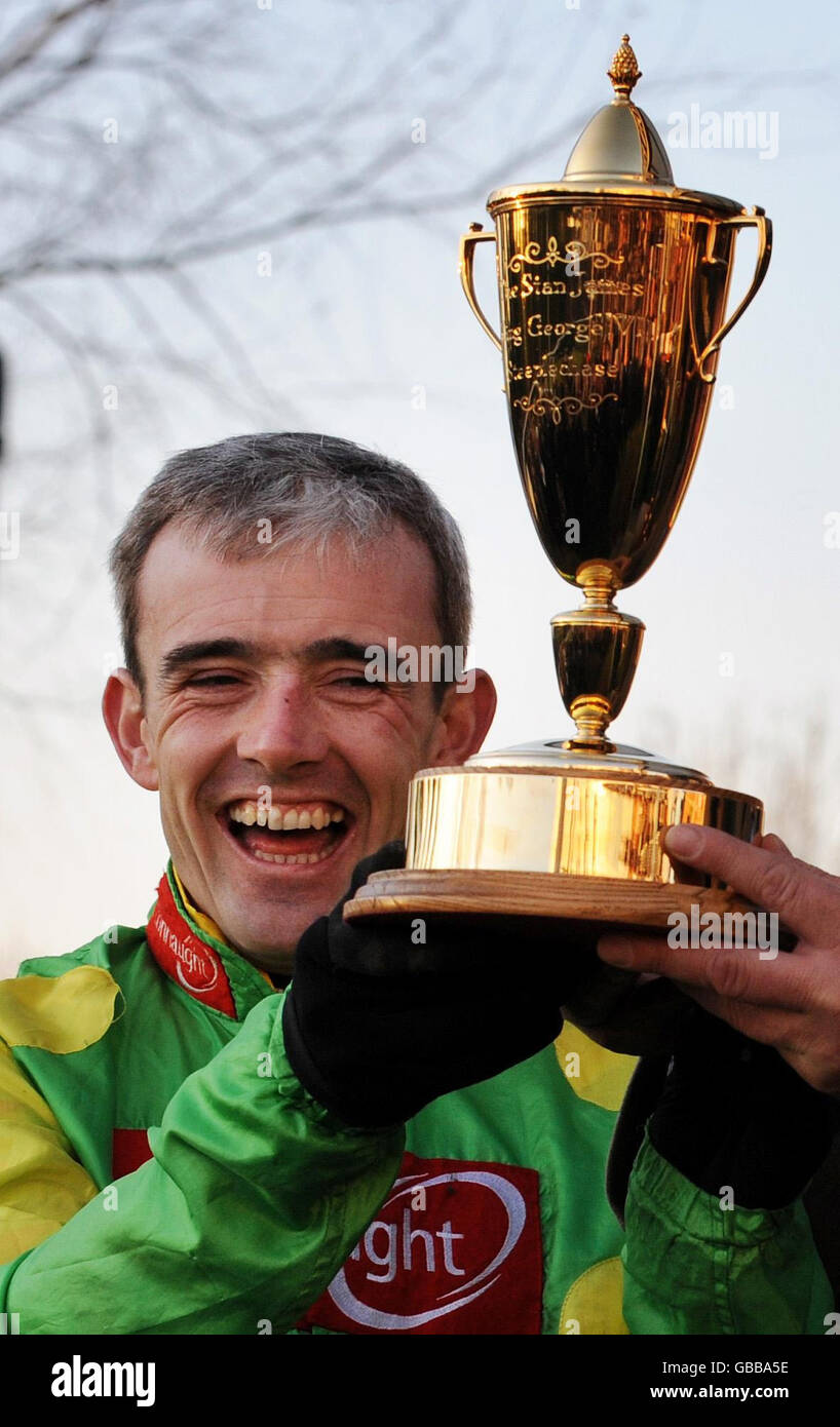 Jockey Ruby Walsh receives the winners trophy after riding Kauto Star ...
