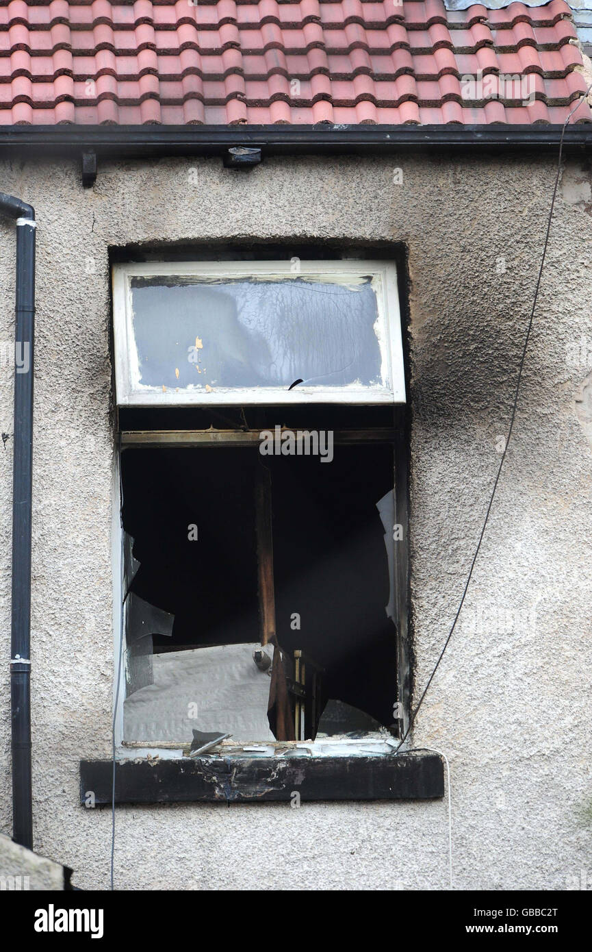 A general view showing an upstairs window at the rear of a fire damaged ...