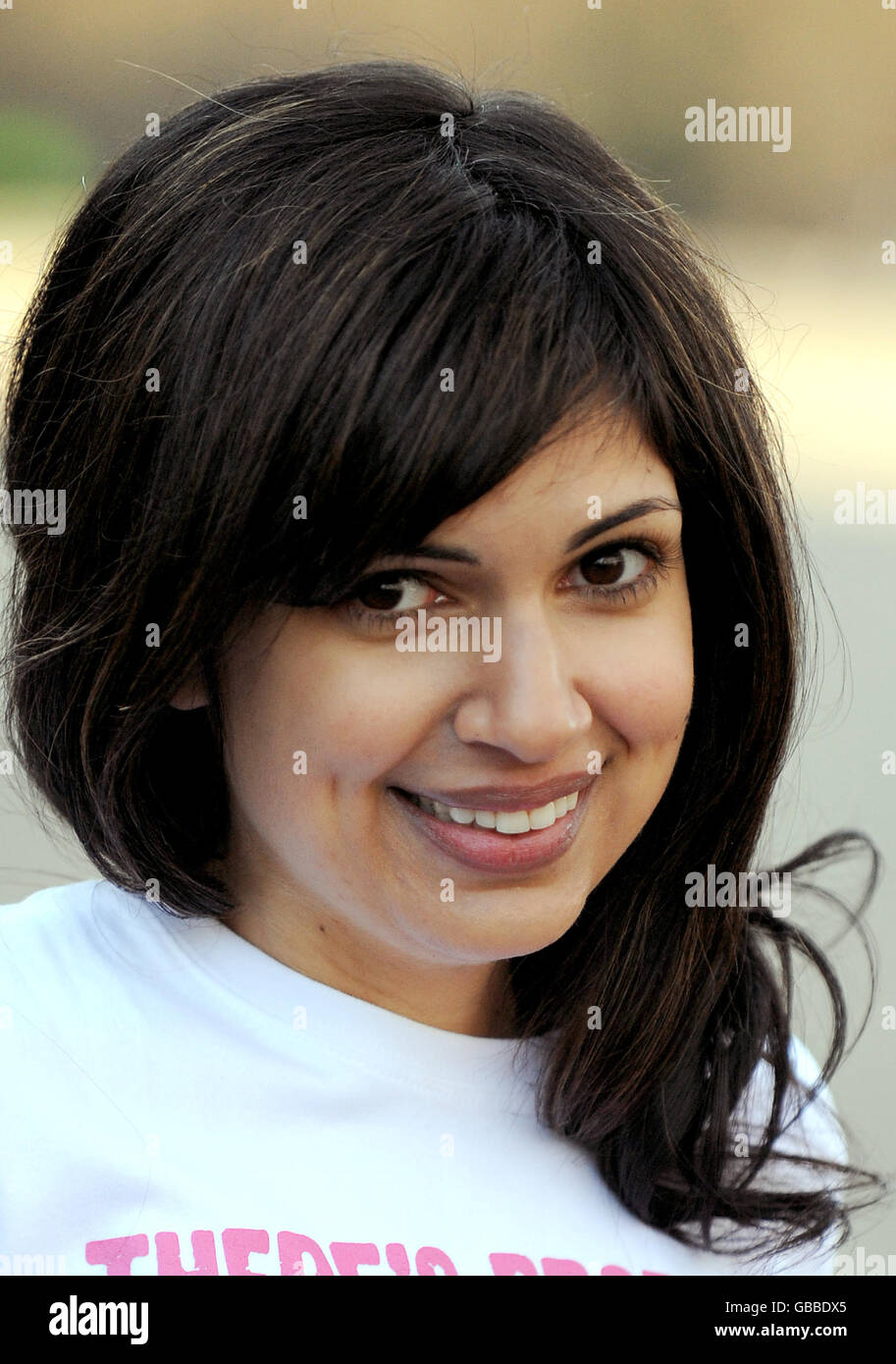 Guardian journalist Ariane Sherine poses beside a bus displaying an ...