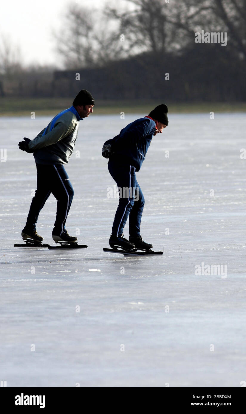 Fen cold snap skating on flooded field in village earith hi-res stock ...