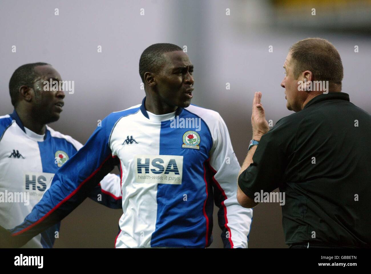 Blackburn Rovers' Andy Cole argues with referee Steve Dunn after being ...