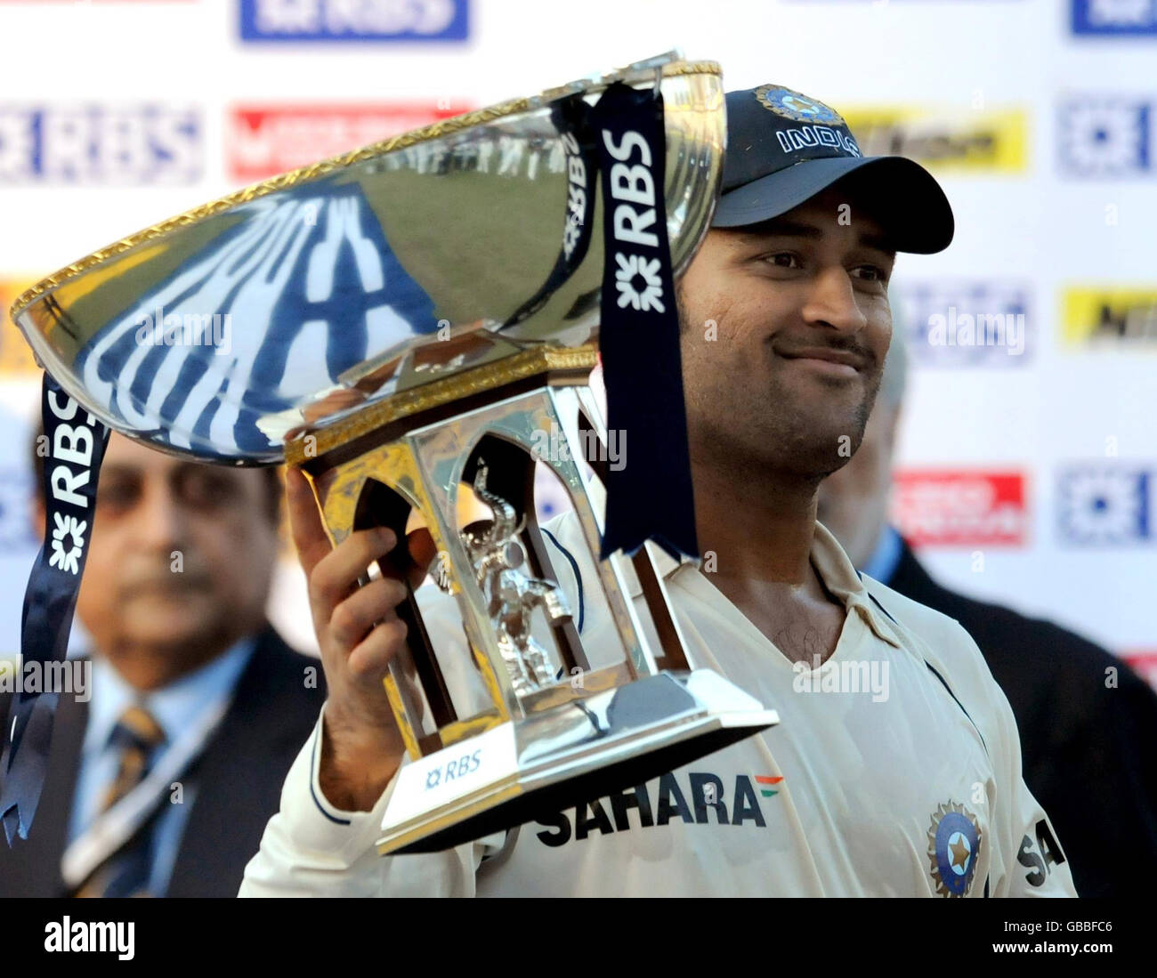 MS Dhoni poses with the RBS trophy following the close of play on the ...