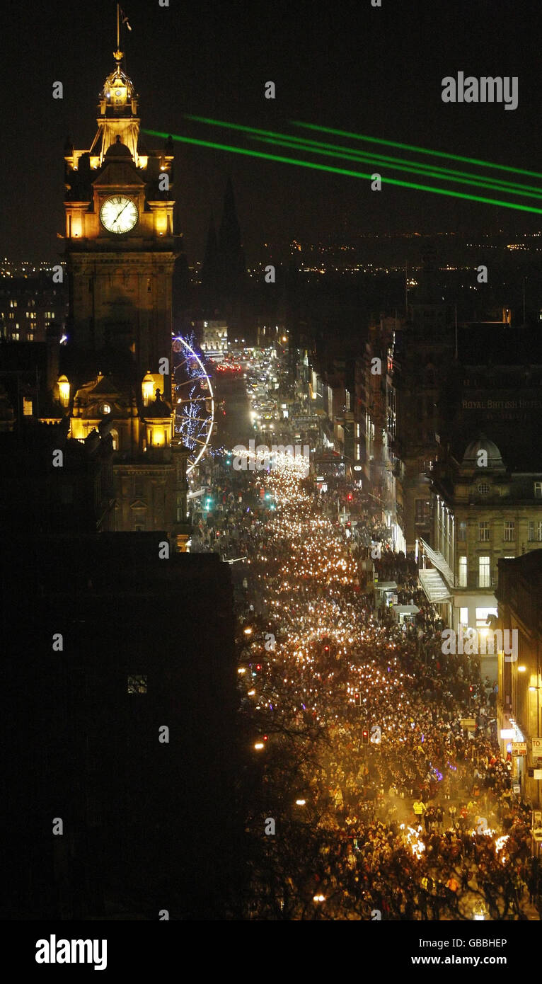 Torches light up Princes Street in Edinburgh during the torchlight ...