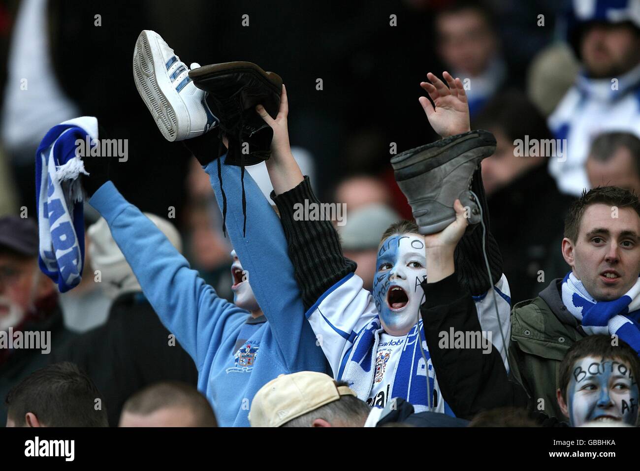 Young fans show support for their side in the hi-res stock photography ...
