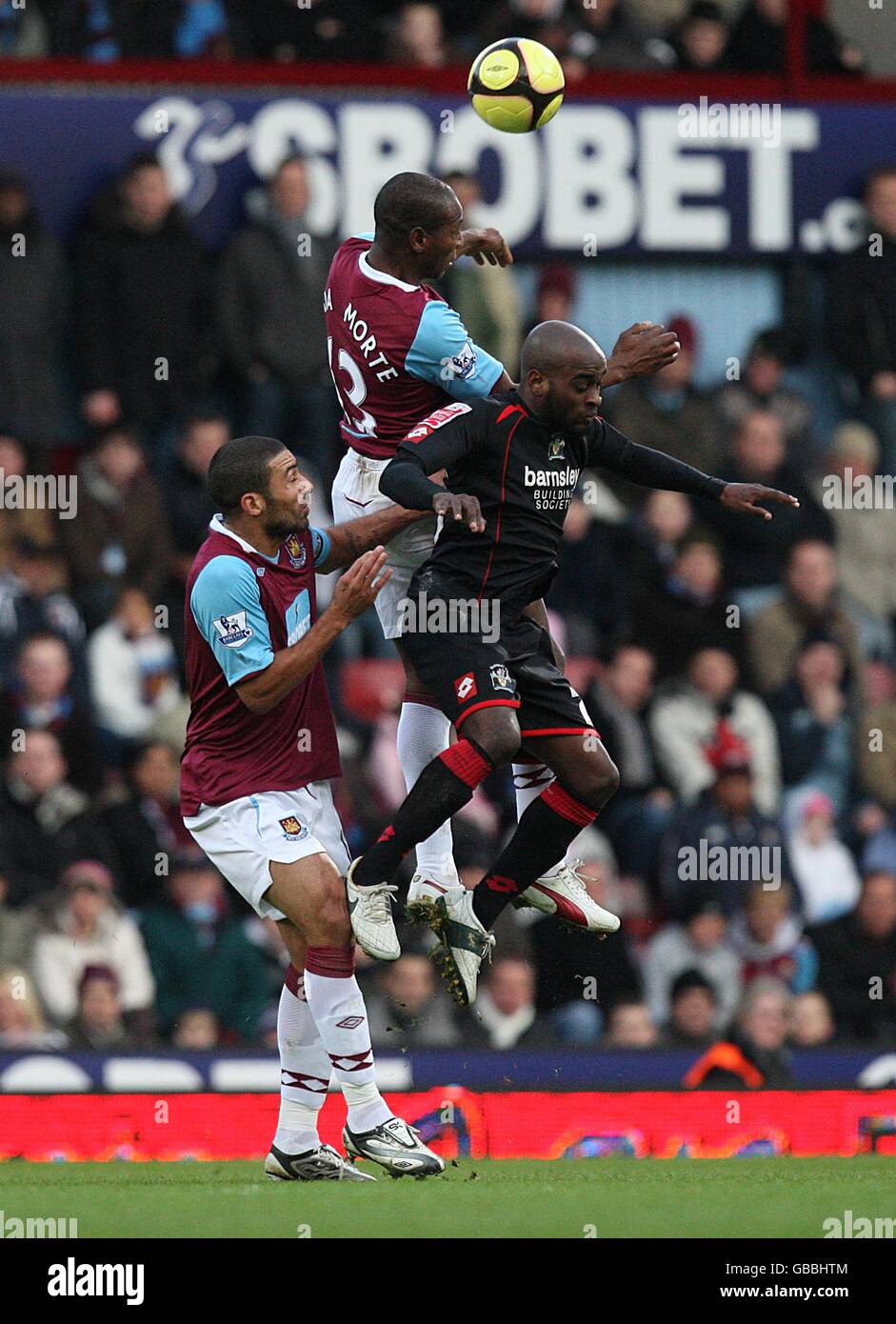 Barnsley's Jamal Campbell-Ryce (right) battles with West Ham United's ...