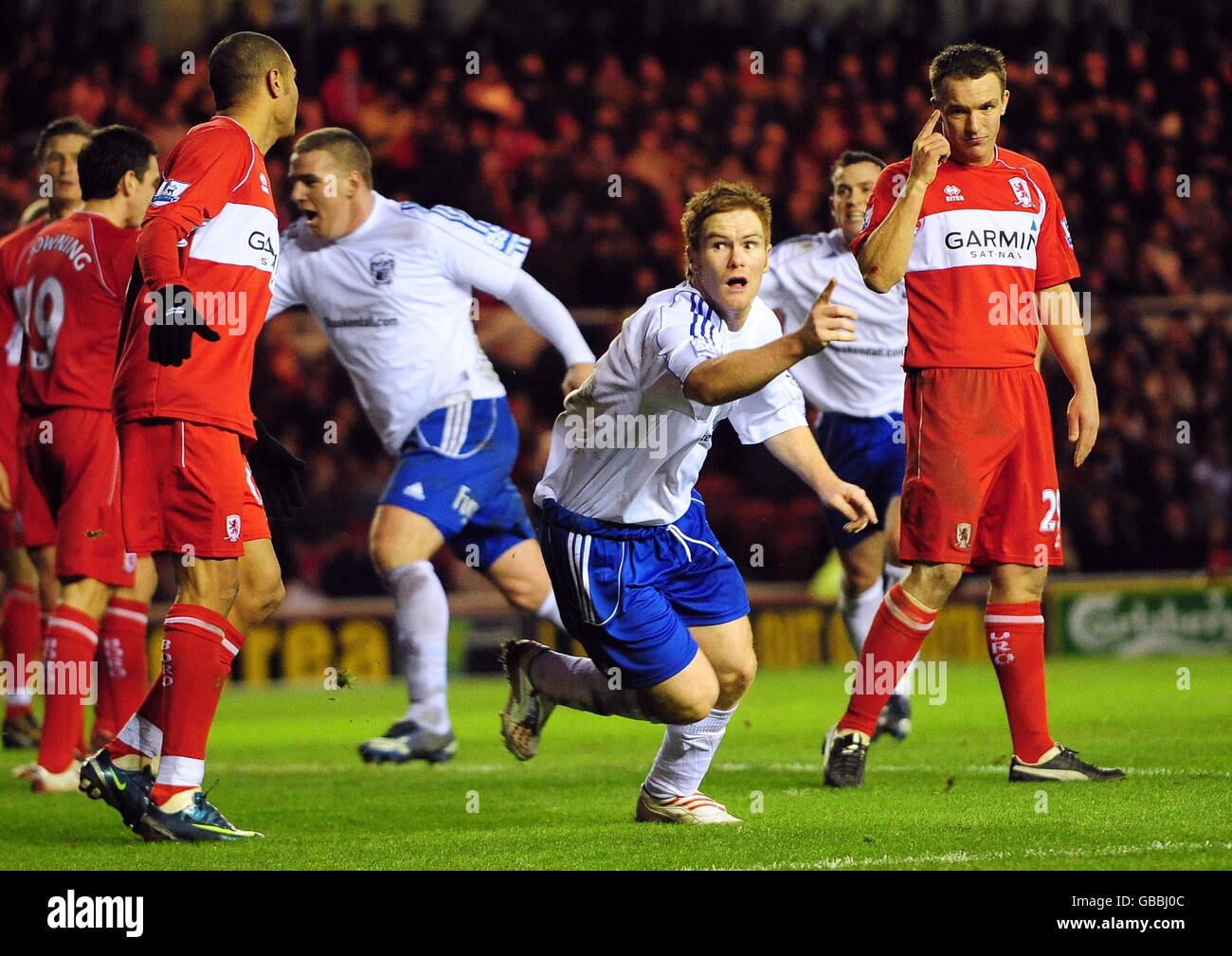 Barrow's Jason Walker (centre) wheels away in celebration after scoring ...