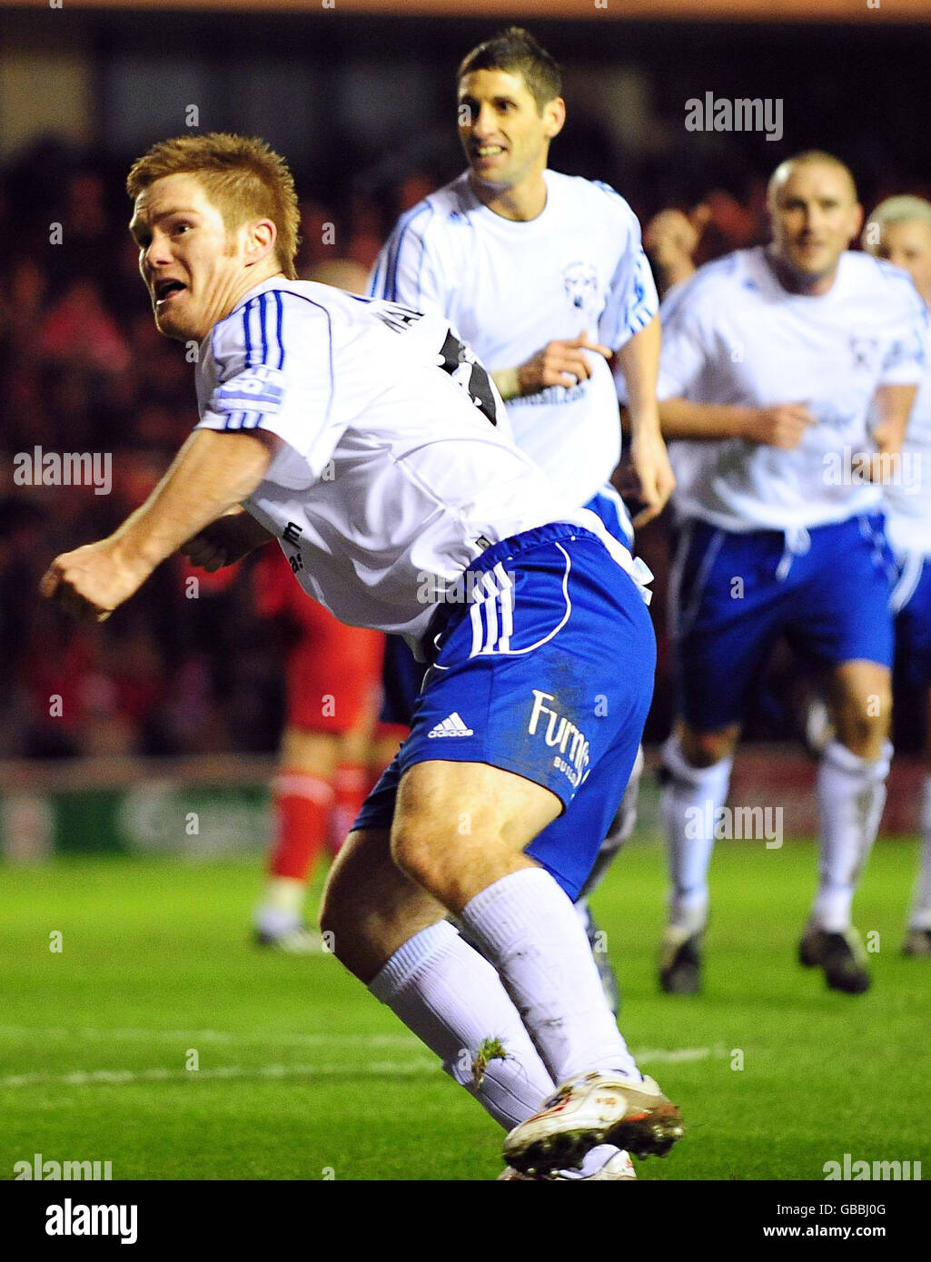 Barrow's Jason Walker (centre) celebrates after scoring his sides first ...